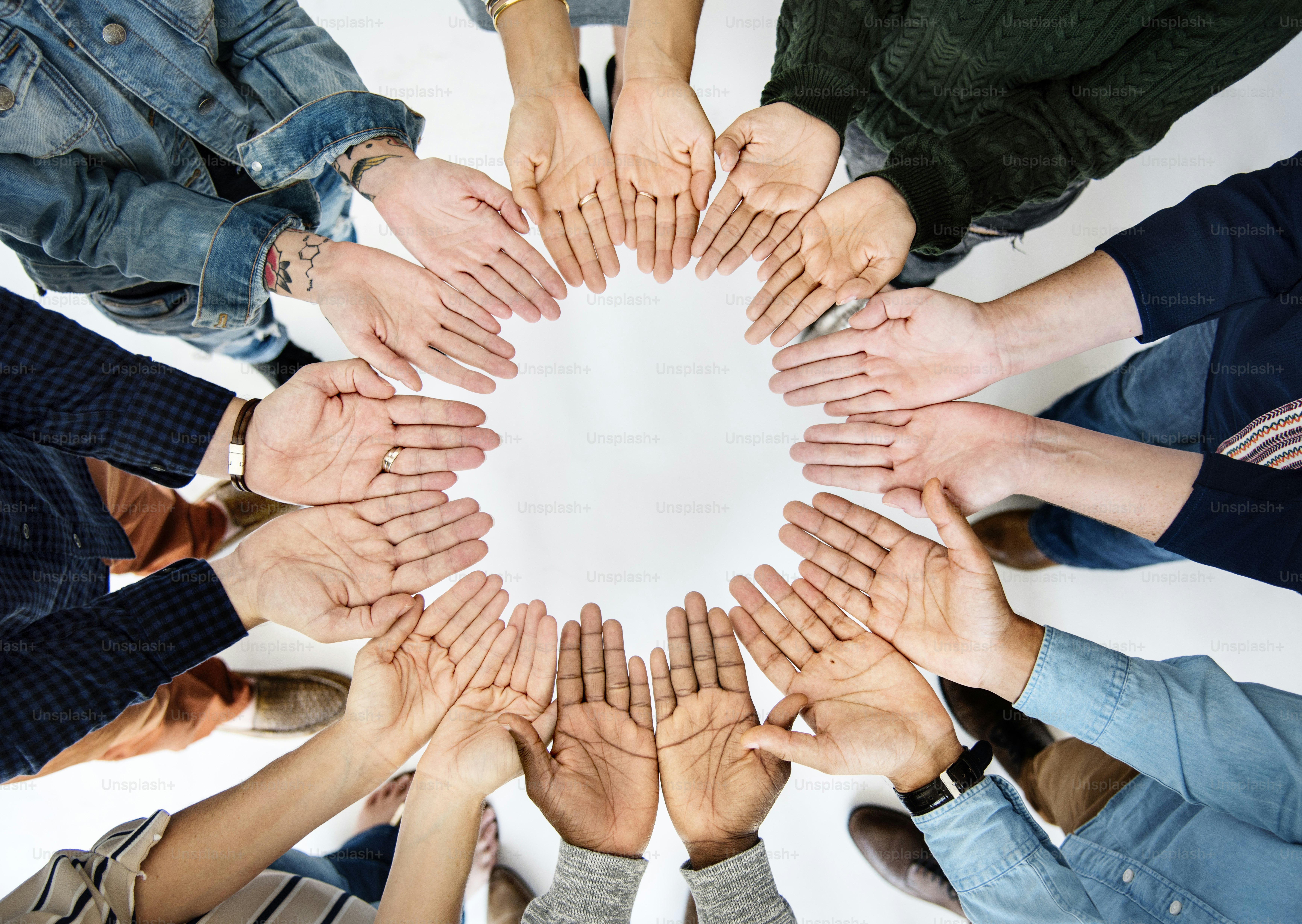 Group of people holding hand assemble together in aerial view photo ...