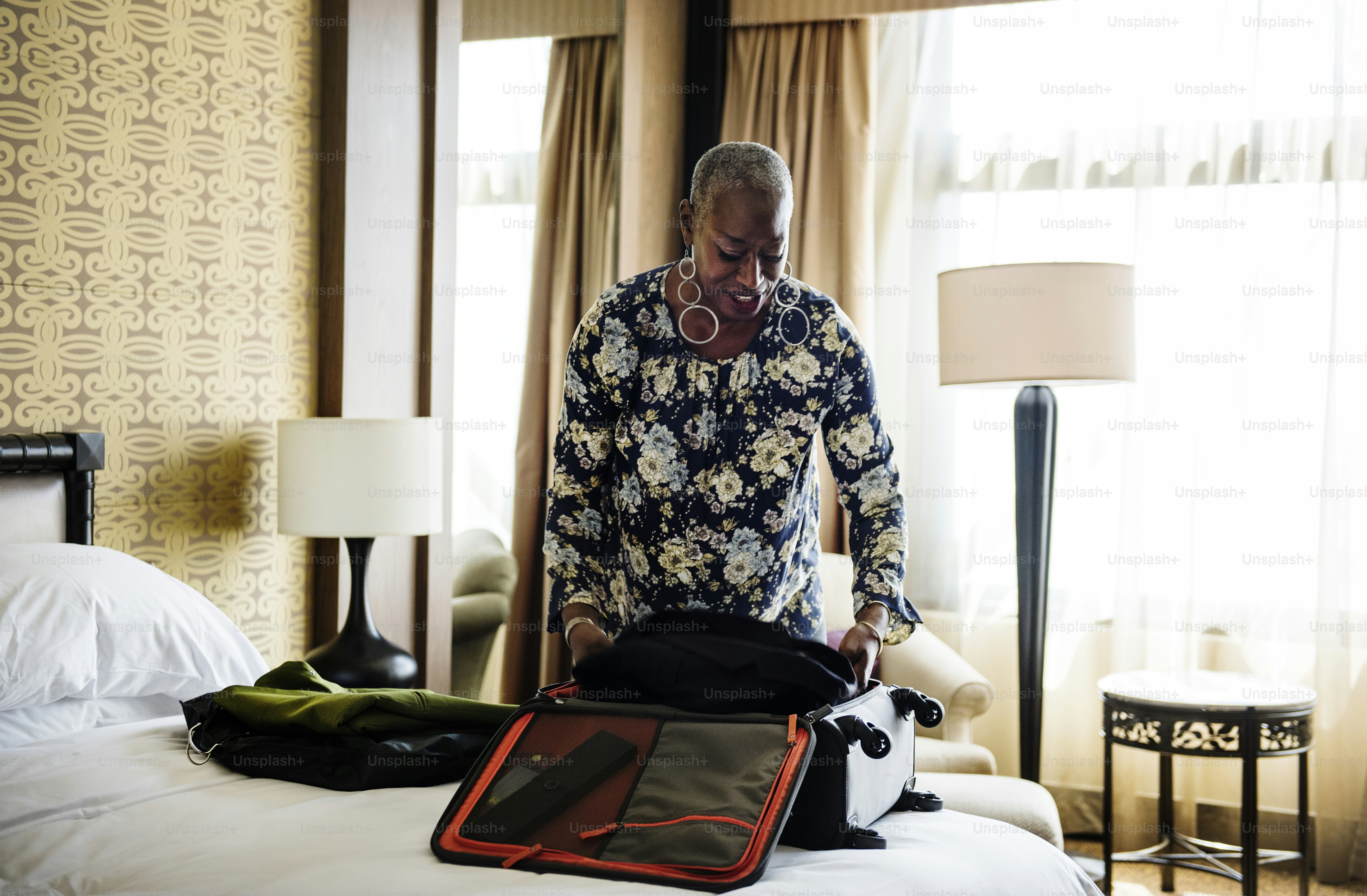 Woman unpacking her suitcase photo – Travel Image on Unsplash