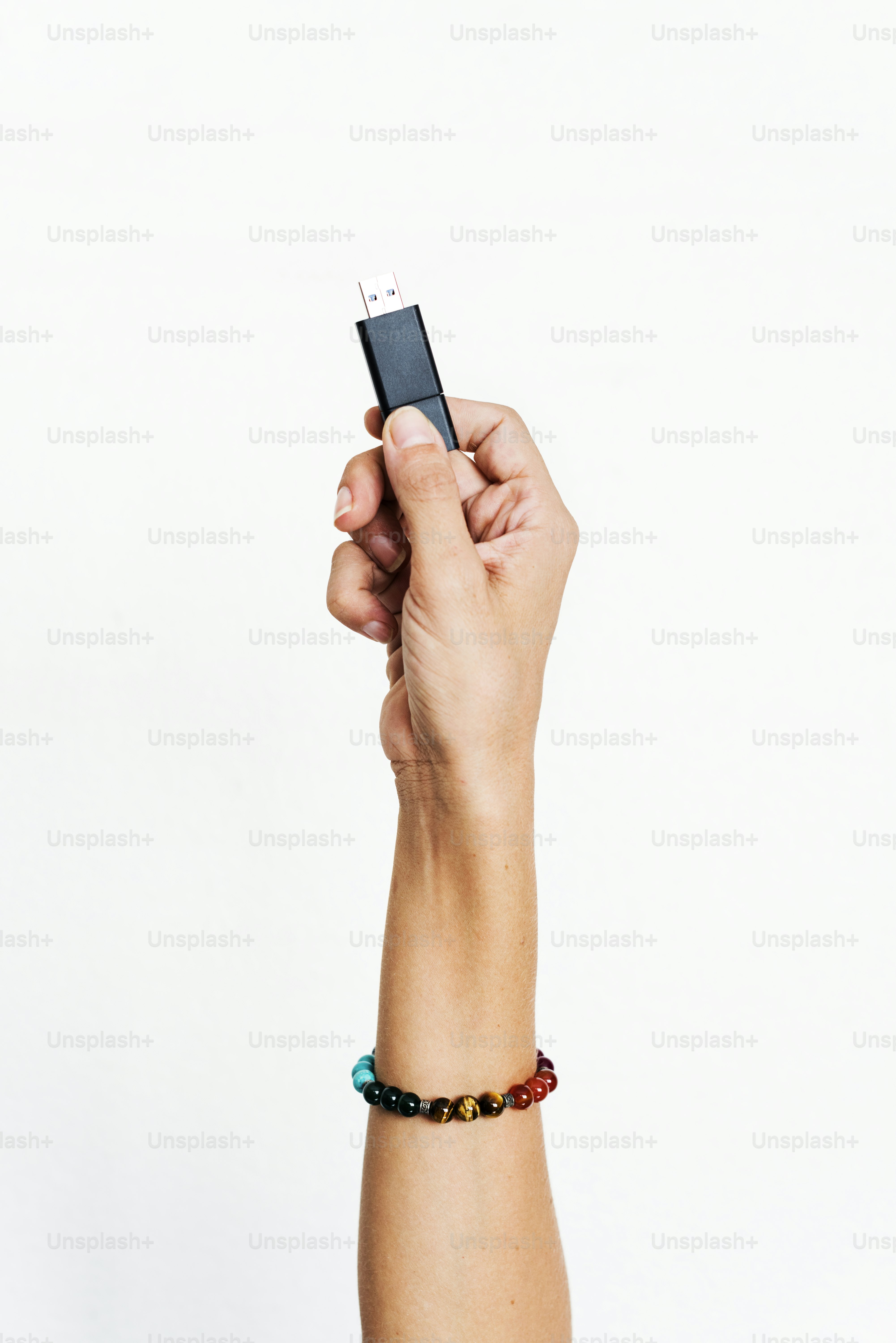 Hand holding data storage handy drive isolated on white photo – Hand ...