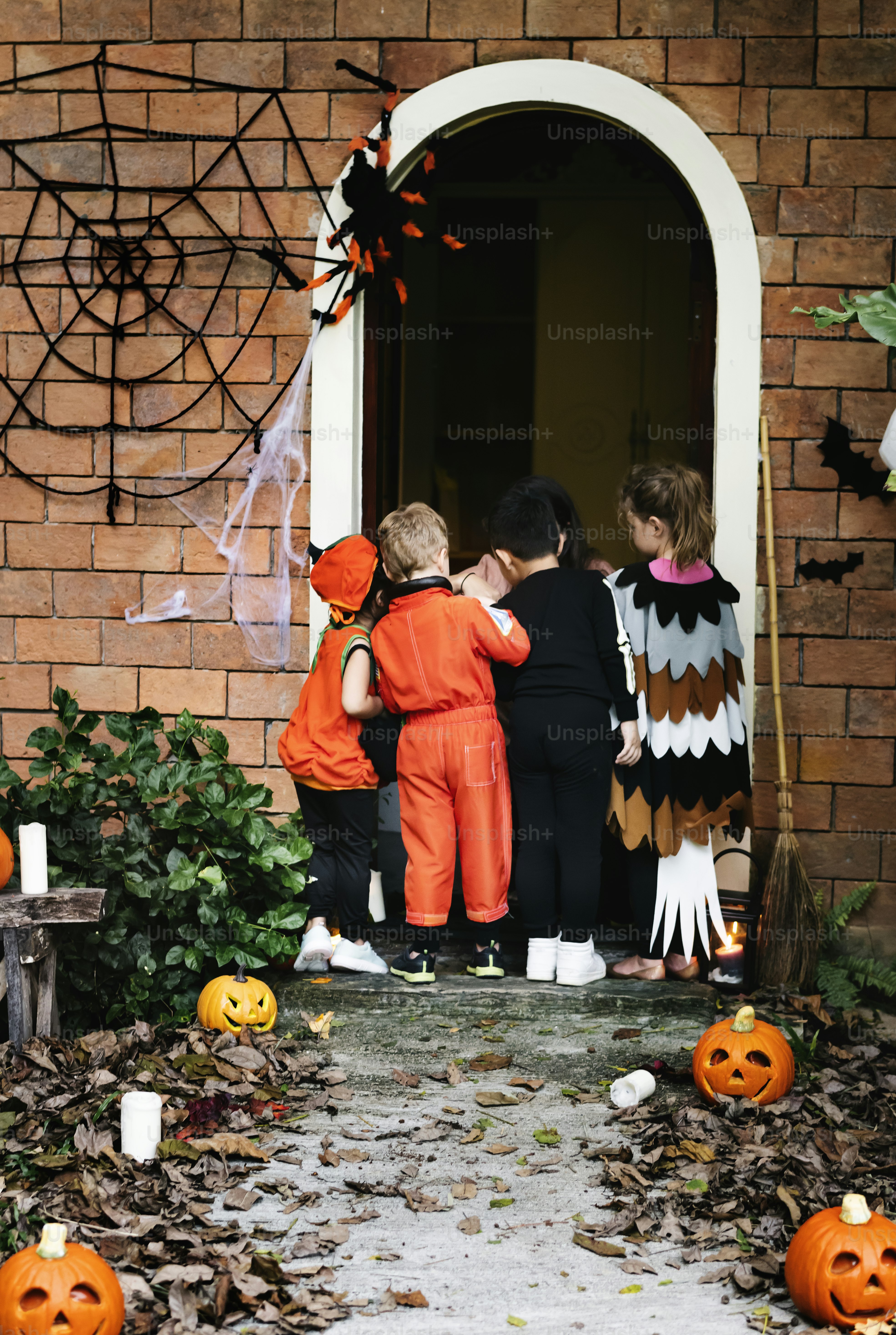 Little children trick or treating on Halloween photo – Tradition Image ...