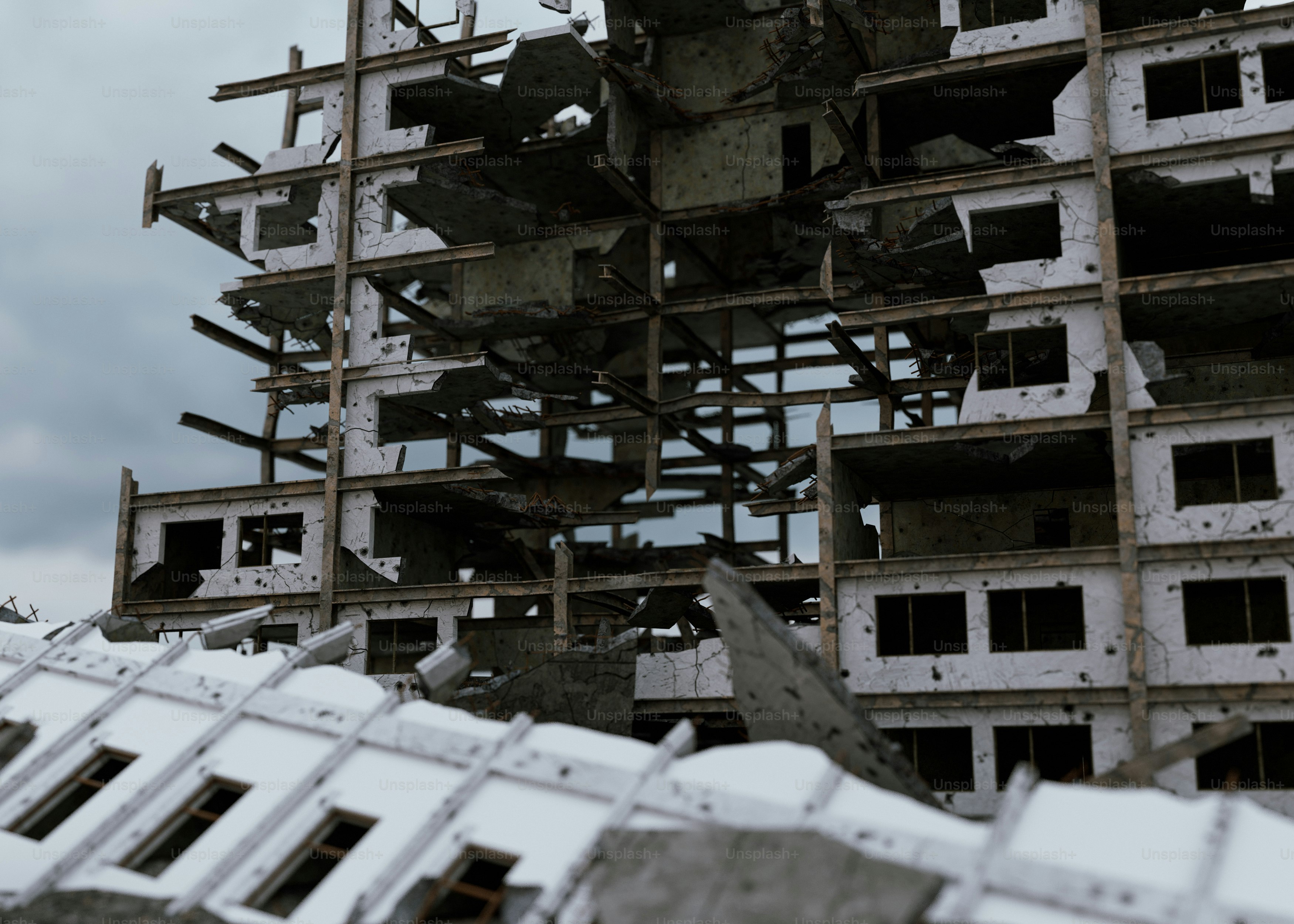 A large pile of rubble with a clock tower in the background photo ...