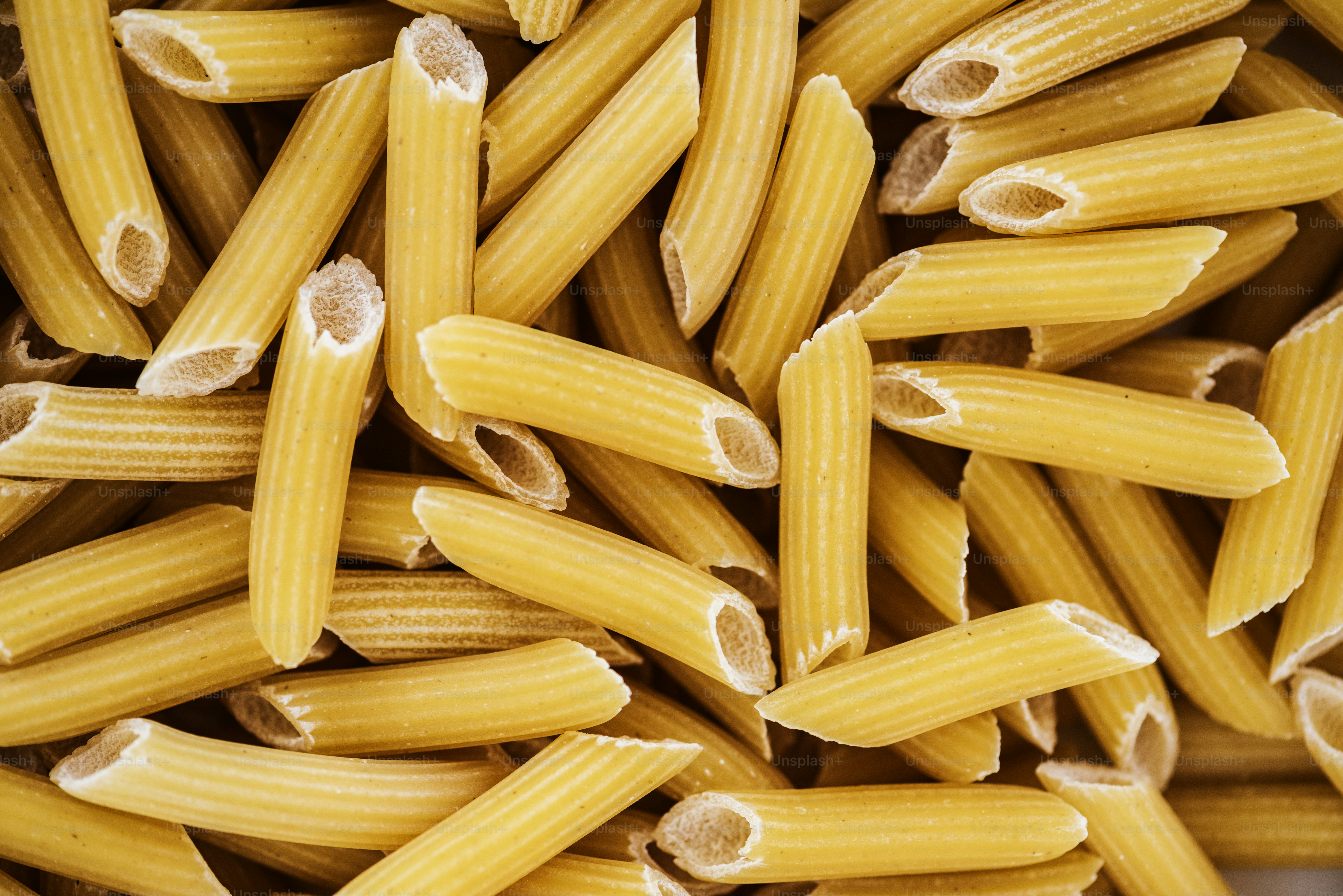 Close up of penne pasta photo – Carbohydrate - food type Image on Unsplash