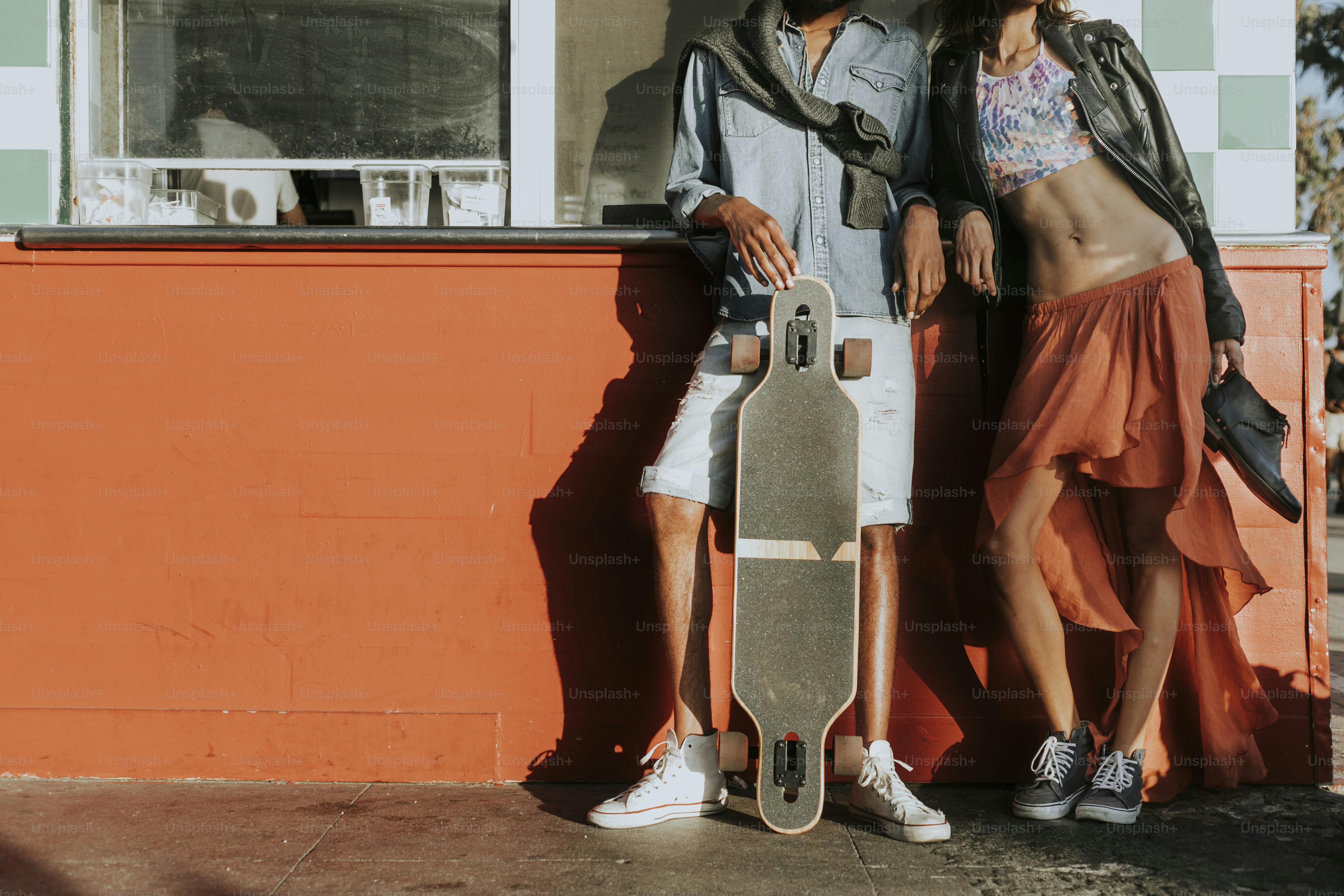 Young slim couple posing with a longboard photo – Human joint Image on ...