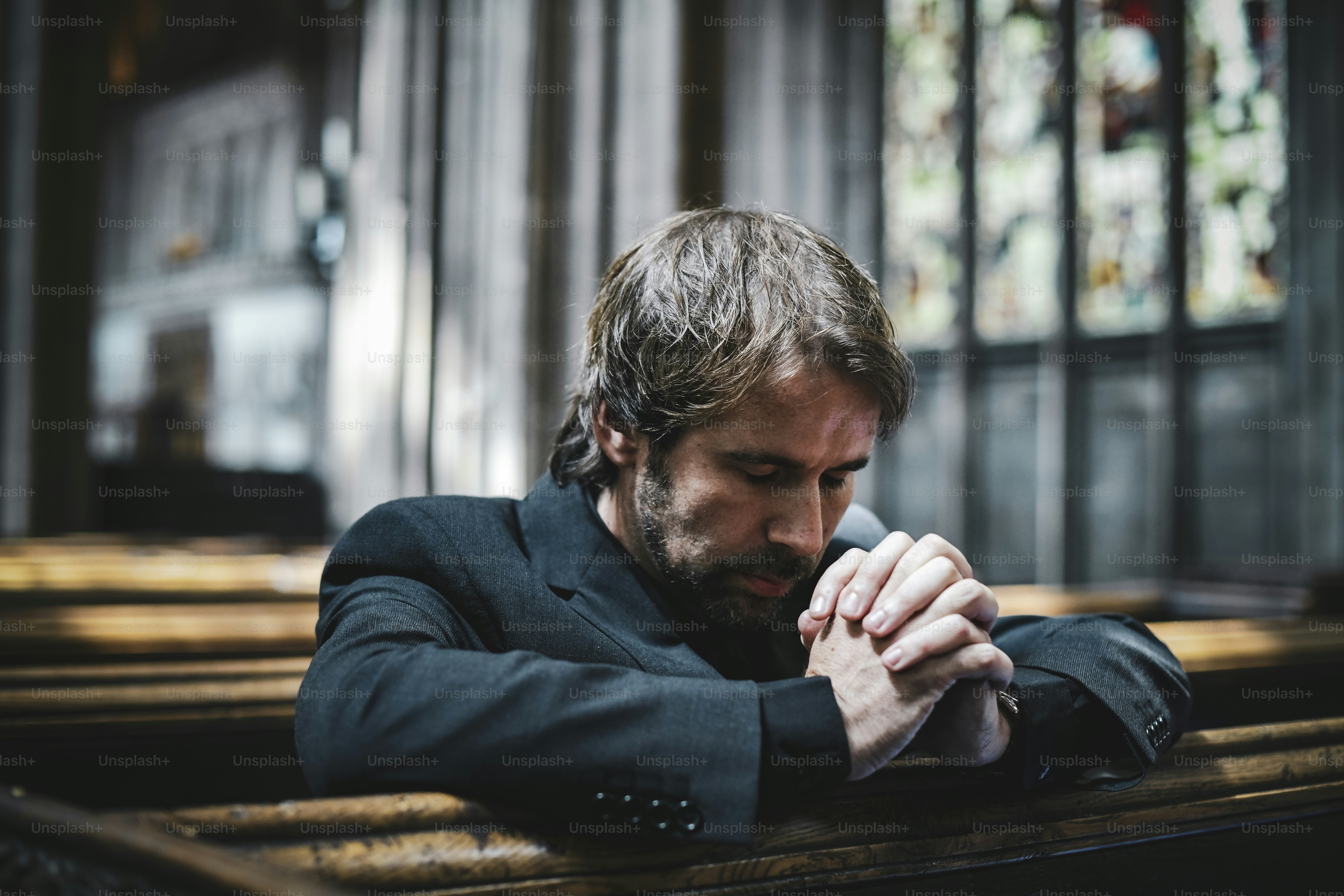 Lonely Christian man praying in the church photo – Tranquility Image on ...