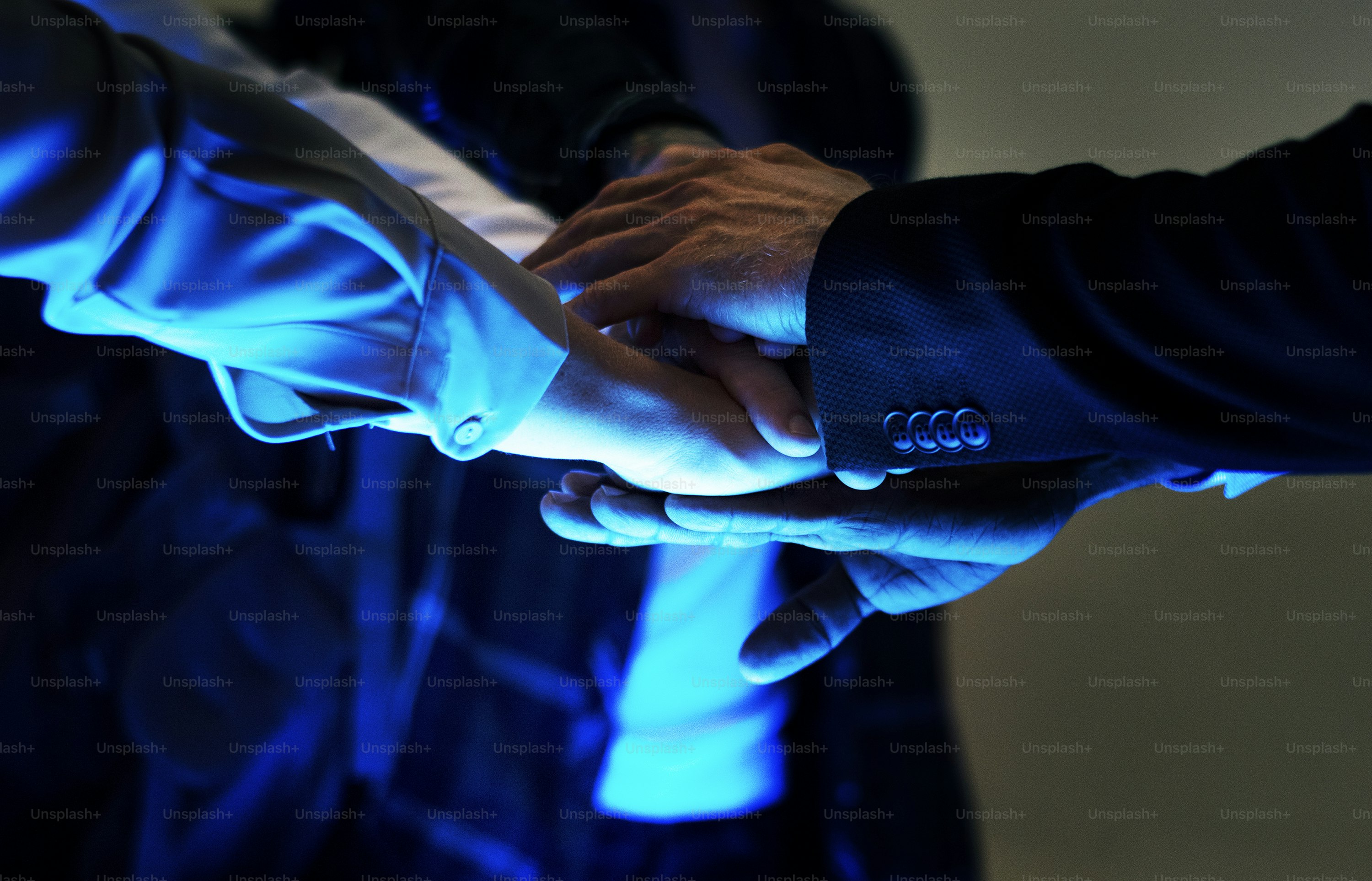 Hands join together in a group meeting photo – Business finance and ...