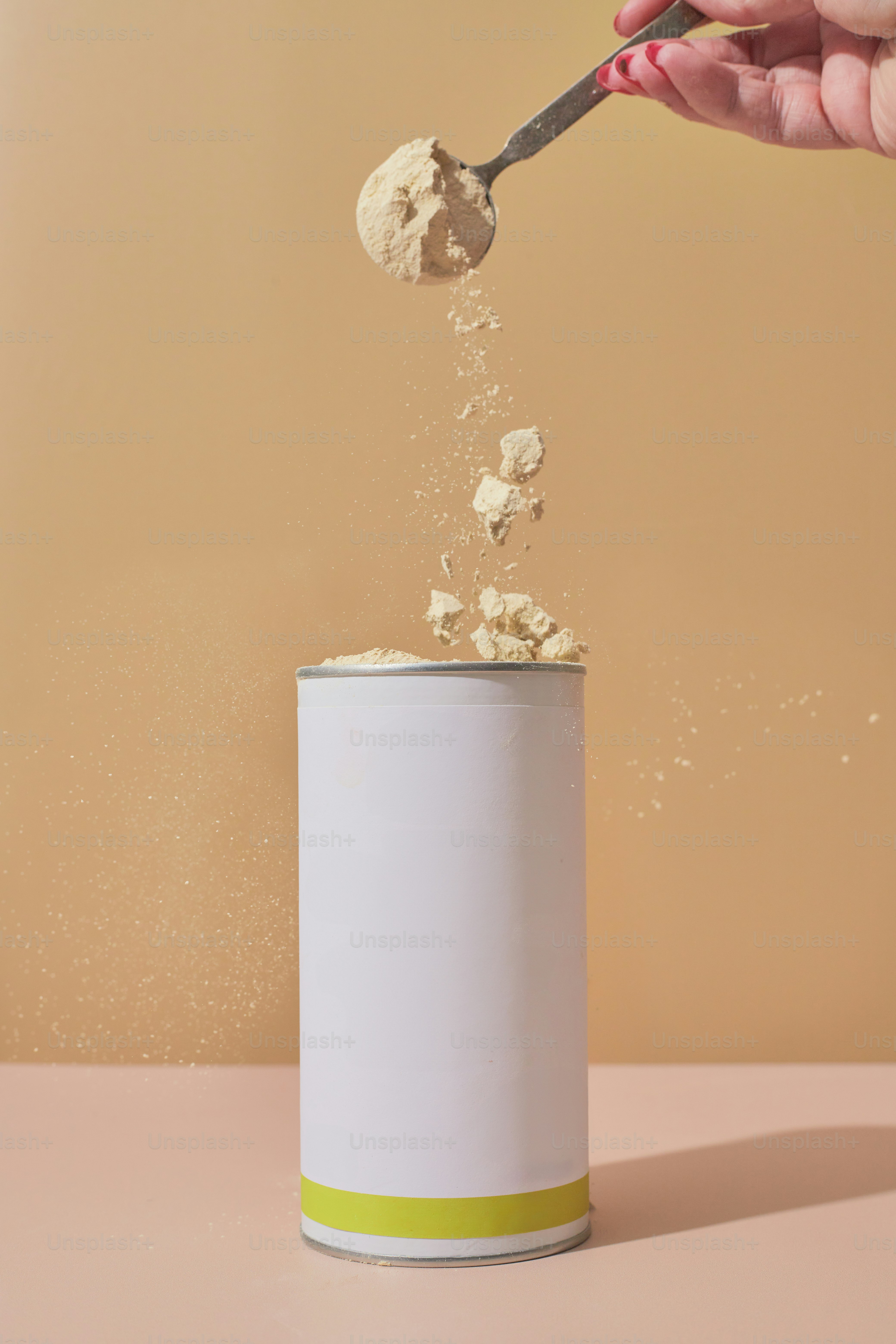 A person is spooning some food out of a can photo – Healthy food Image ...