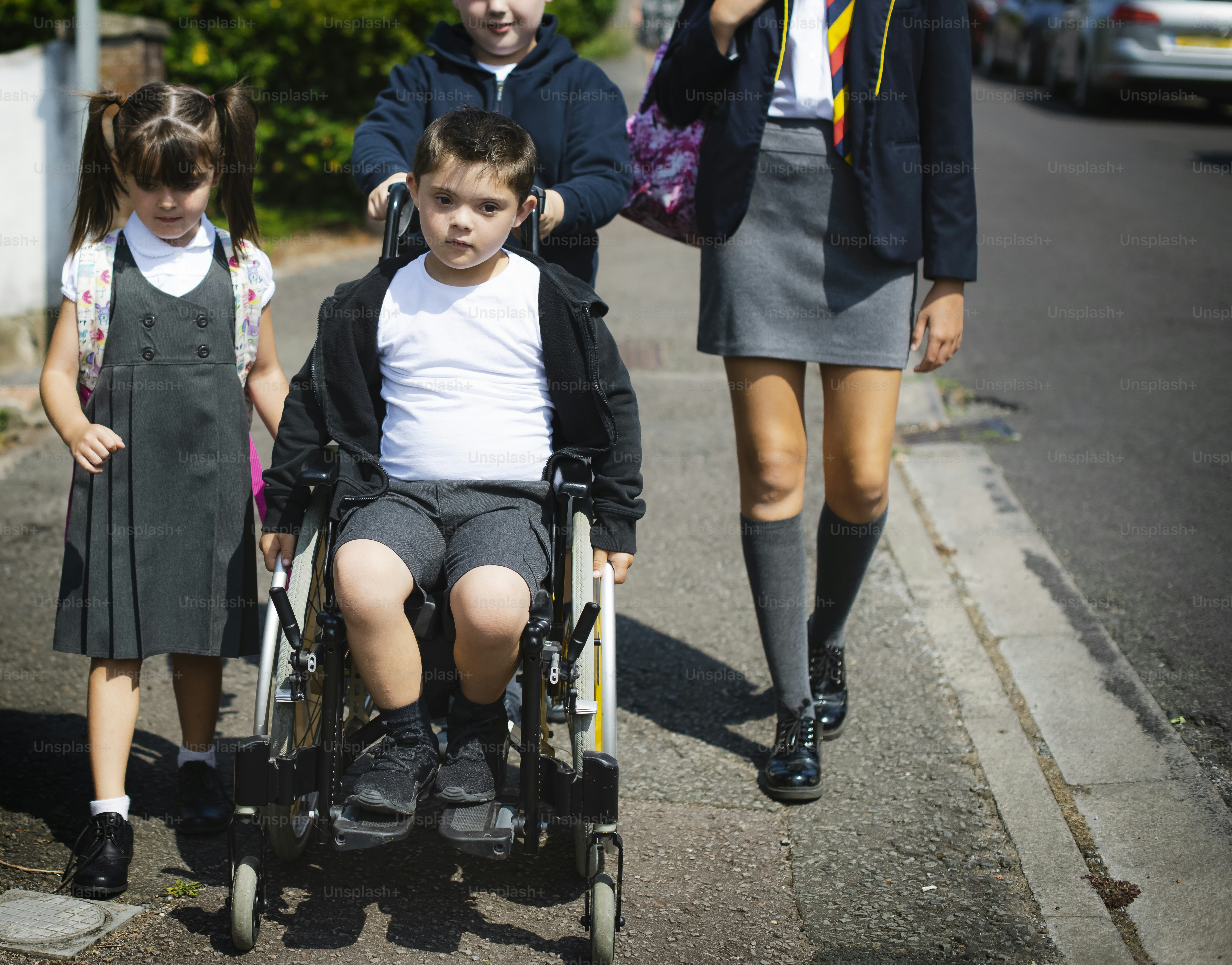 Sisters and brothers on their way to school photo – Persons with ...
