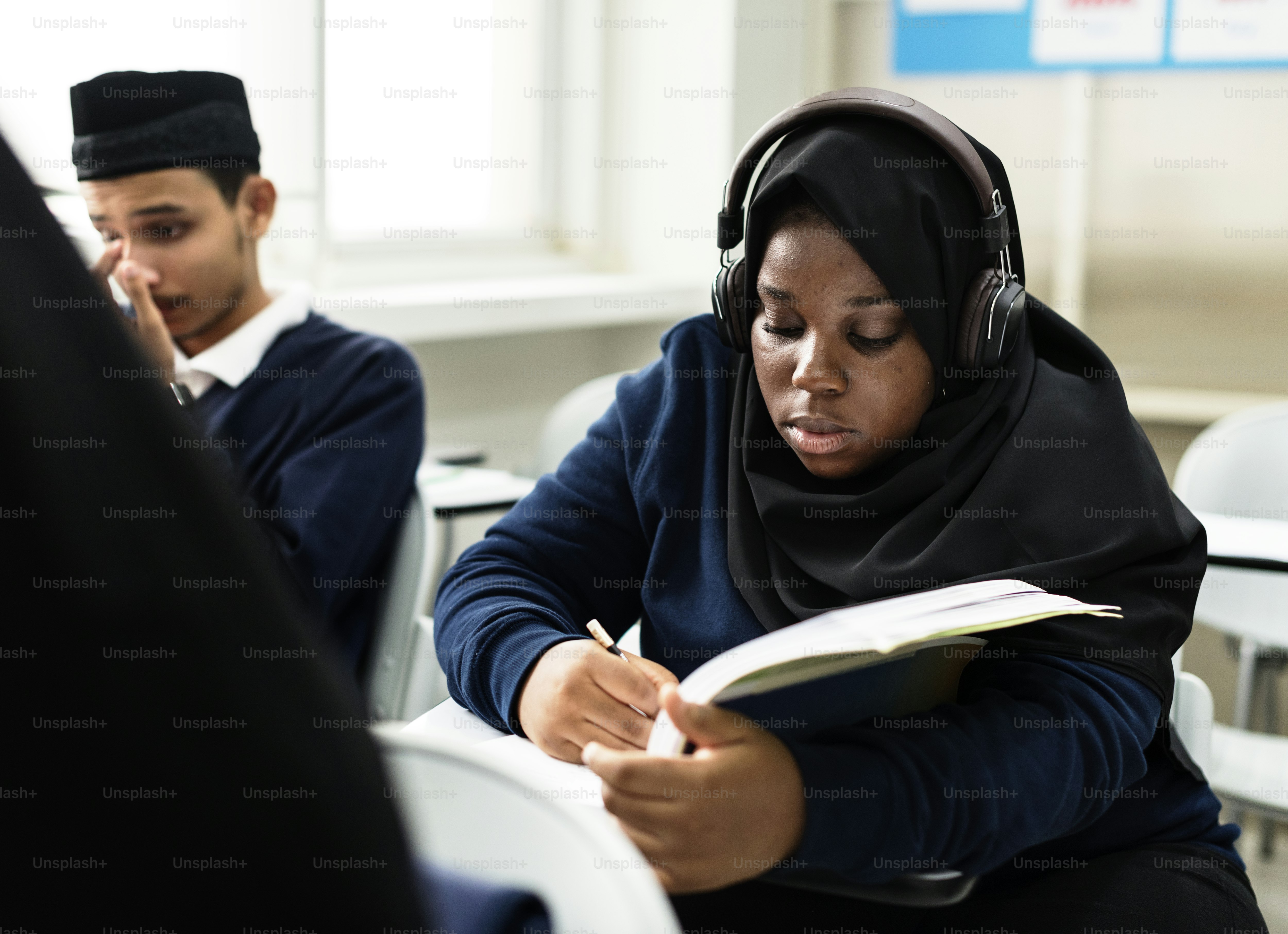 Diverse muslim children studying in classroom photo – Dubai Image on ...