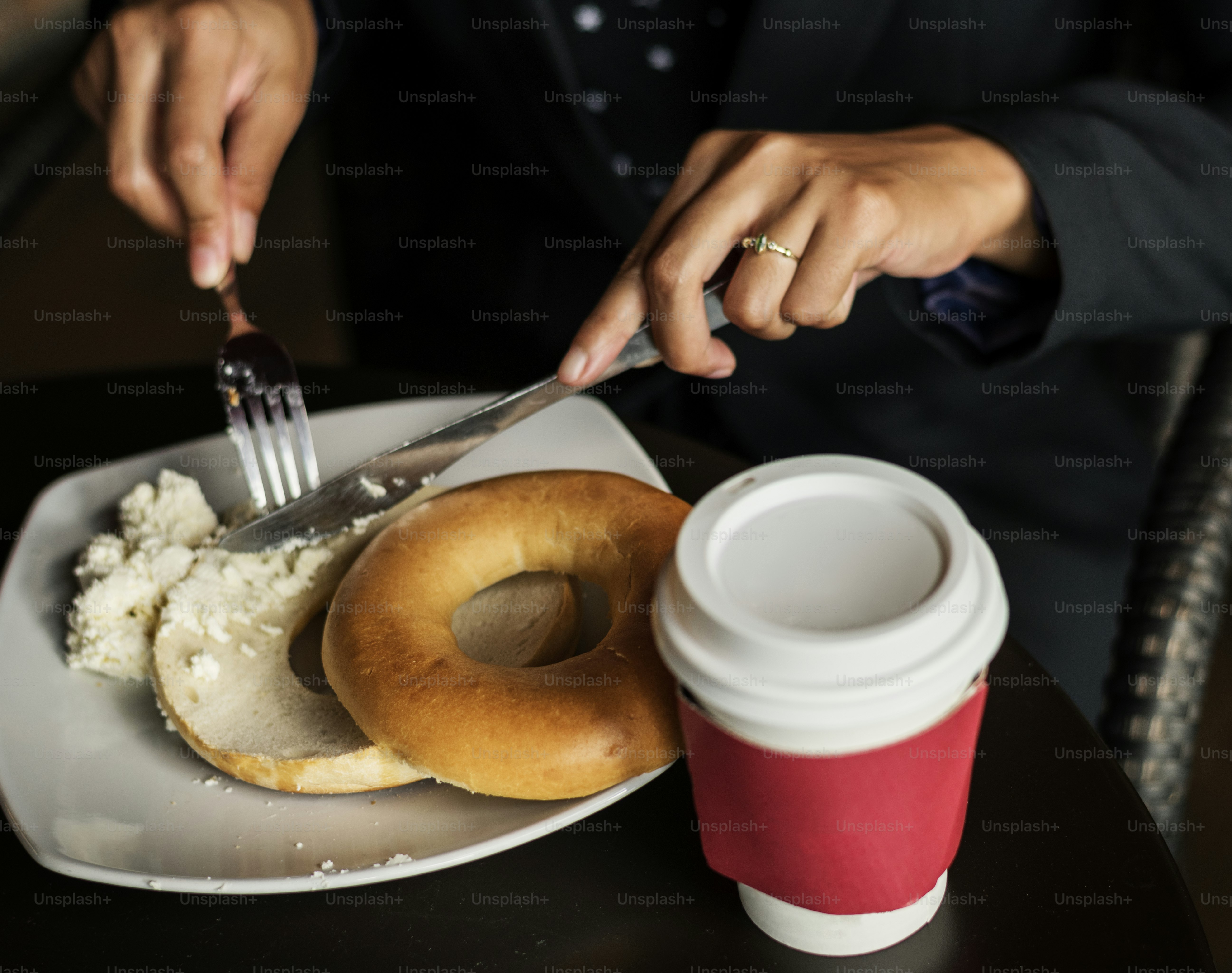 Woman having a bagel for breakfast photo – Adults only Image on Unsplash