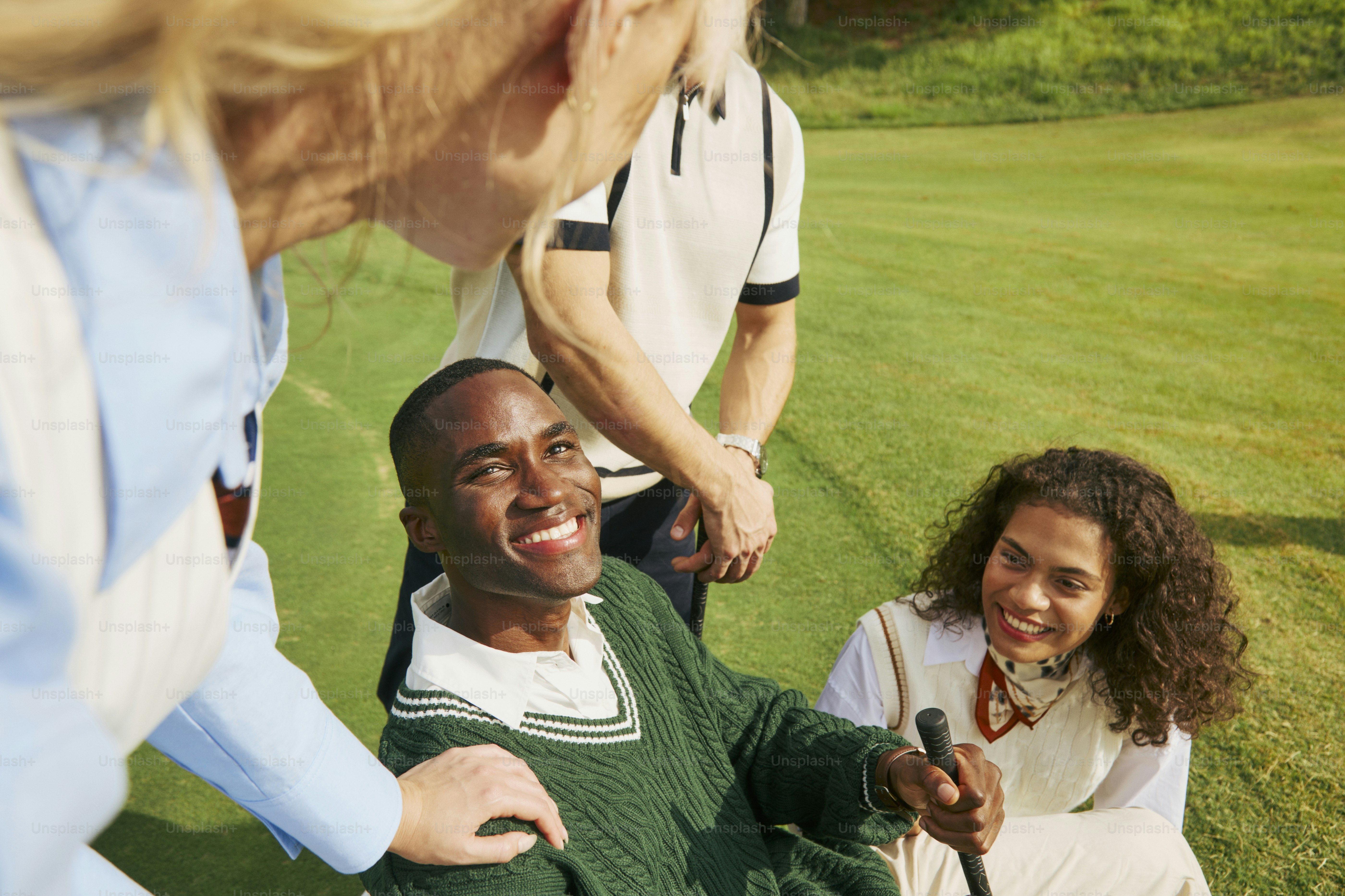 A group of people standing around each other photo – Style Image on ...