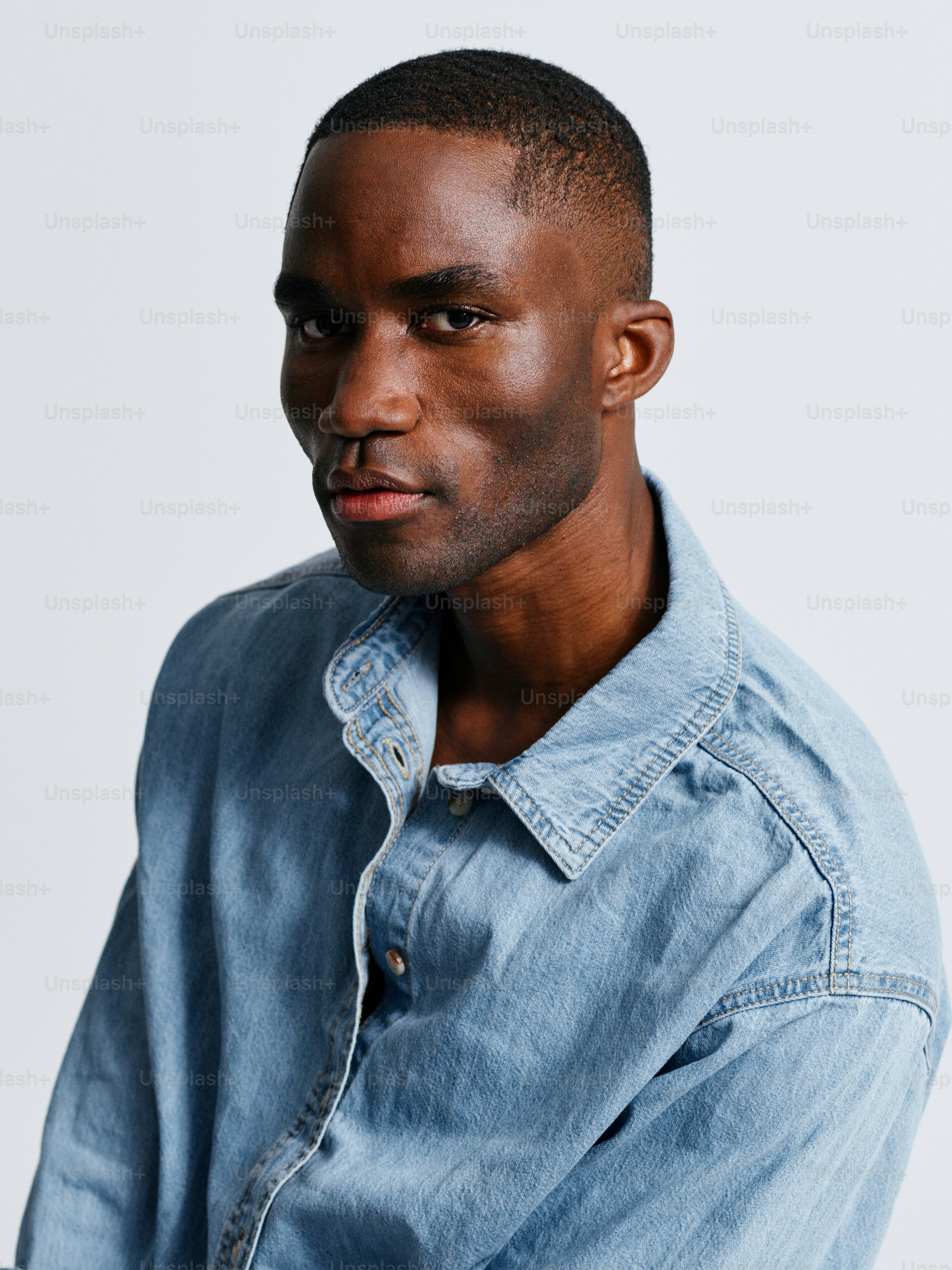 A man in a denim shirt looking at the camera photo – Portrait Image on ...