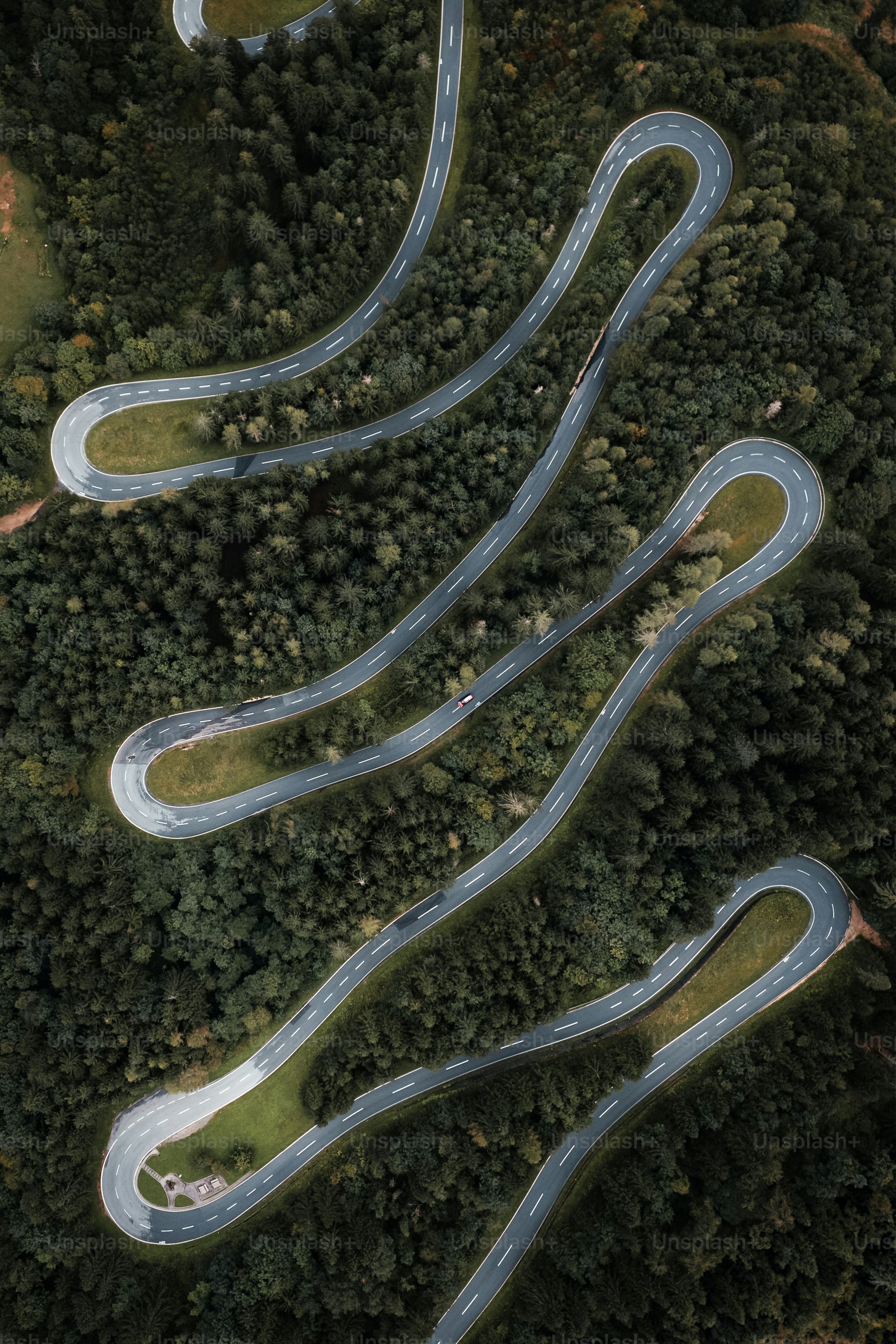 An aerial view of a group of road curves photo – Slovenia Image on Unsplash
