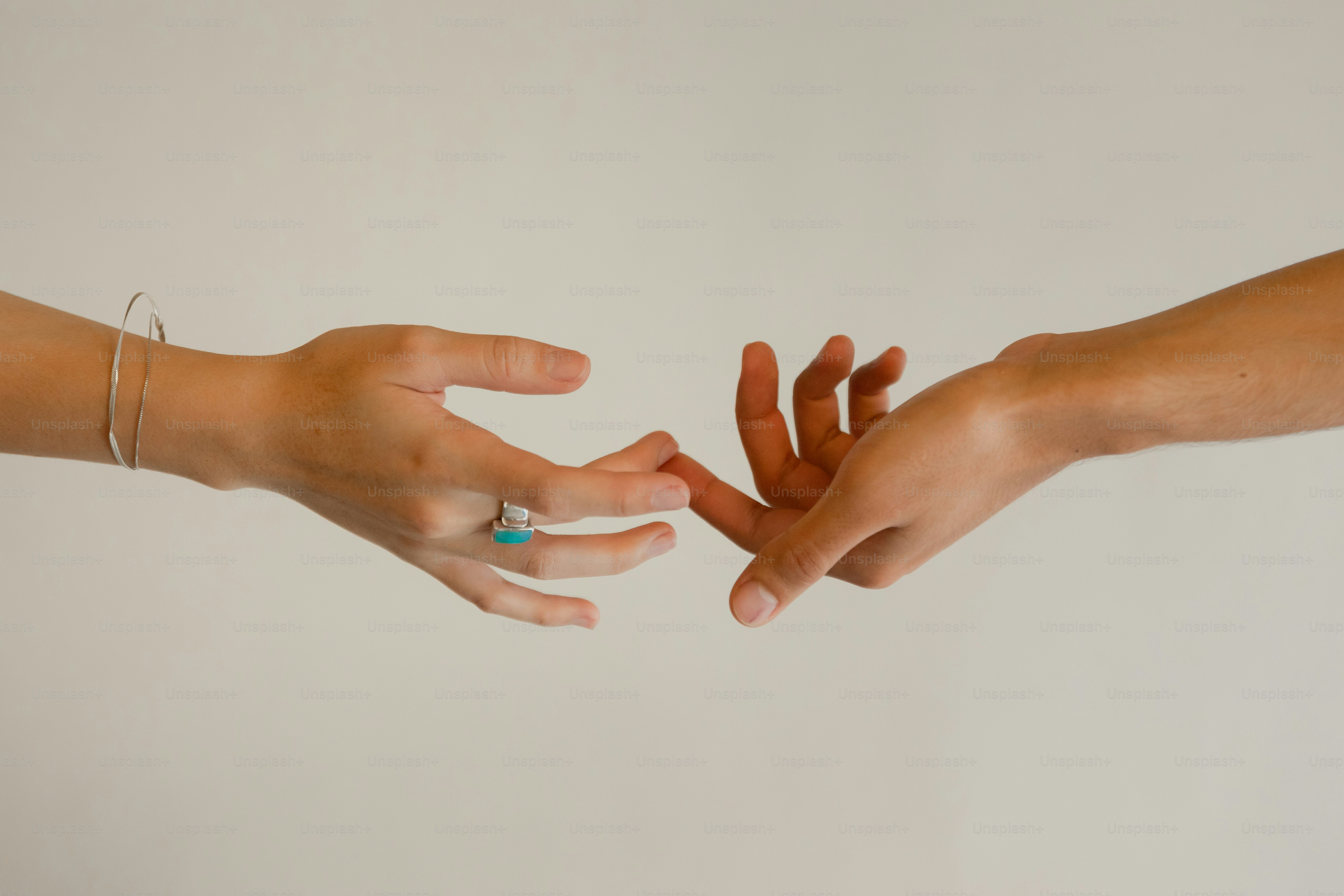 Two people reaching out their hands to each other photo – Fingers Image ...