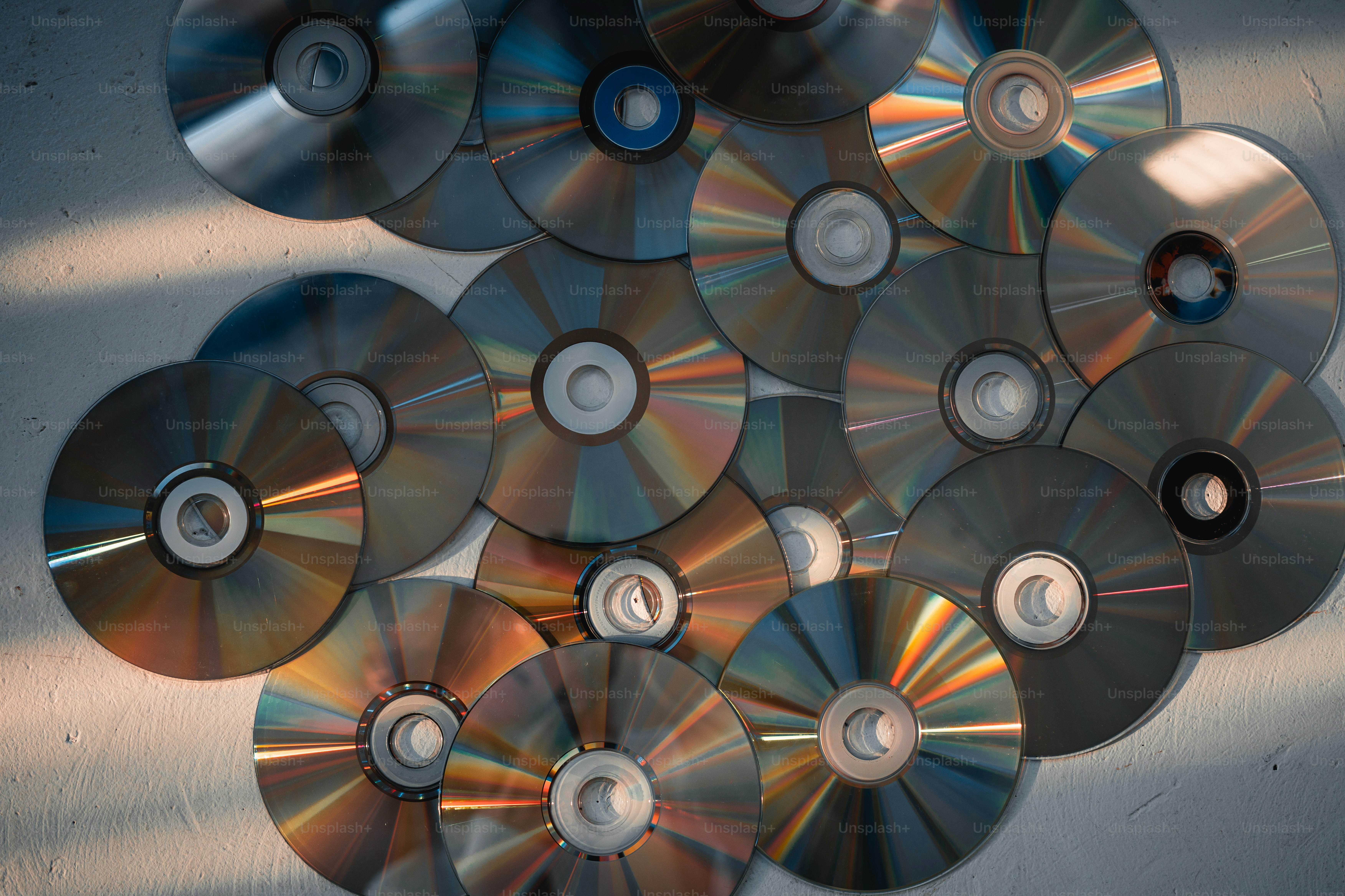 A group of cds sitting on top of a table photo – Retro aesthetic Image ...