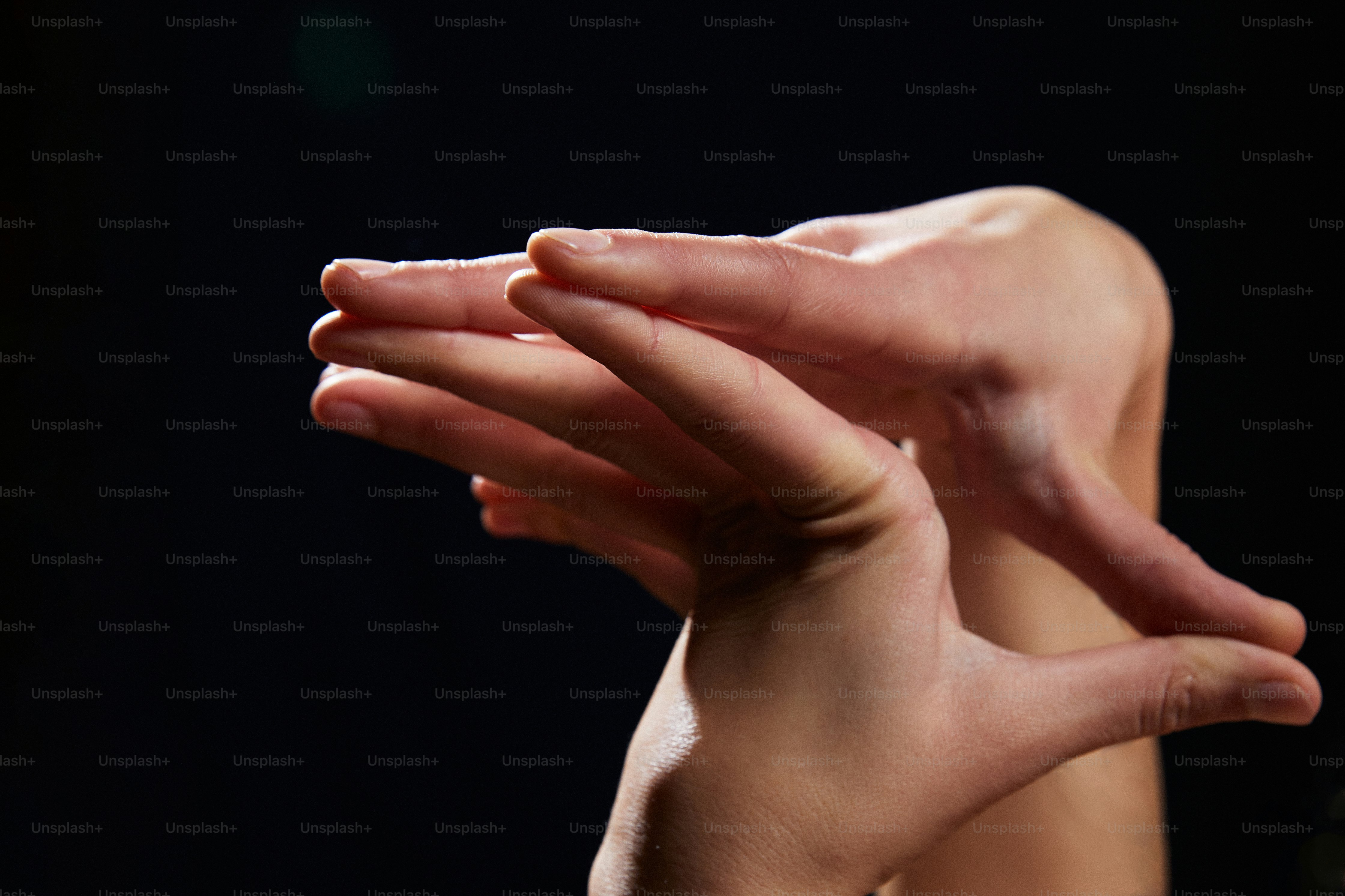 A person holding their hands up in the air photo – Human body Image on ...