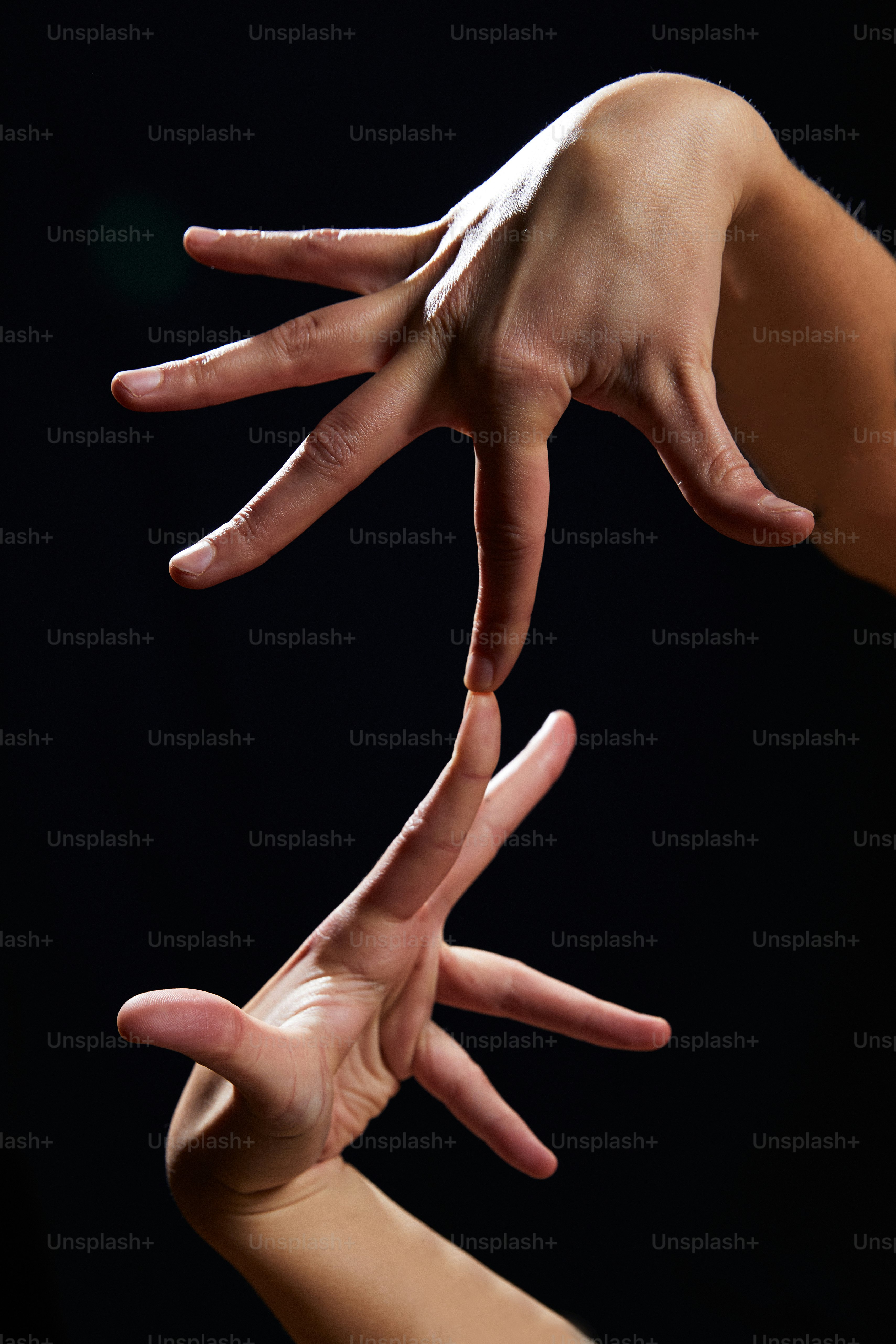 A group of hands reaching up towards each other photo – Human body ...