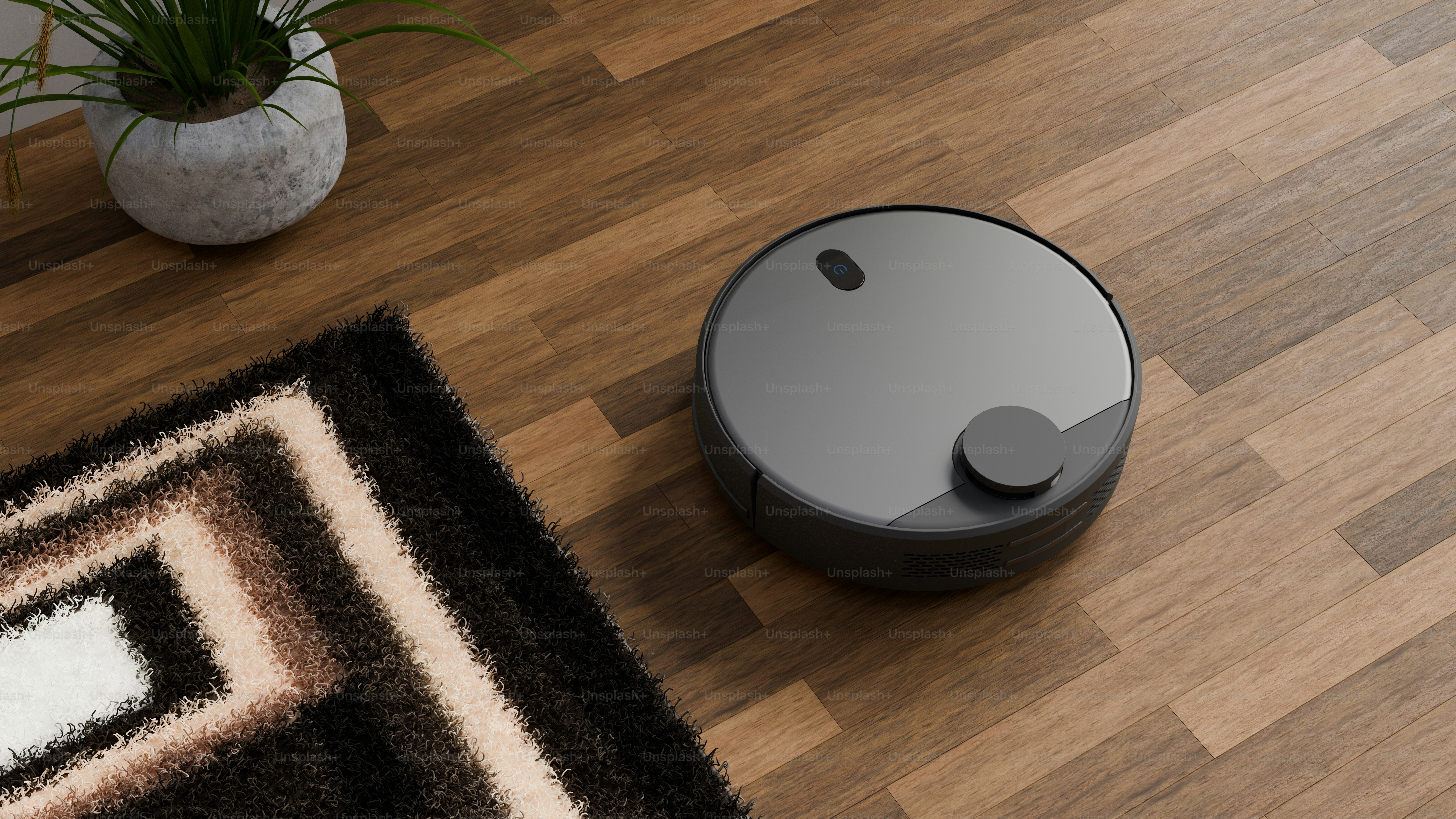 A roomba is sitting on the floor next to a potted plant photo – Smart ...