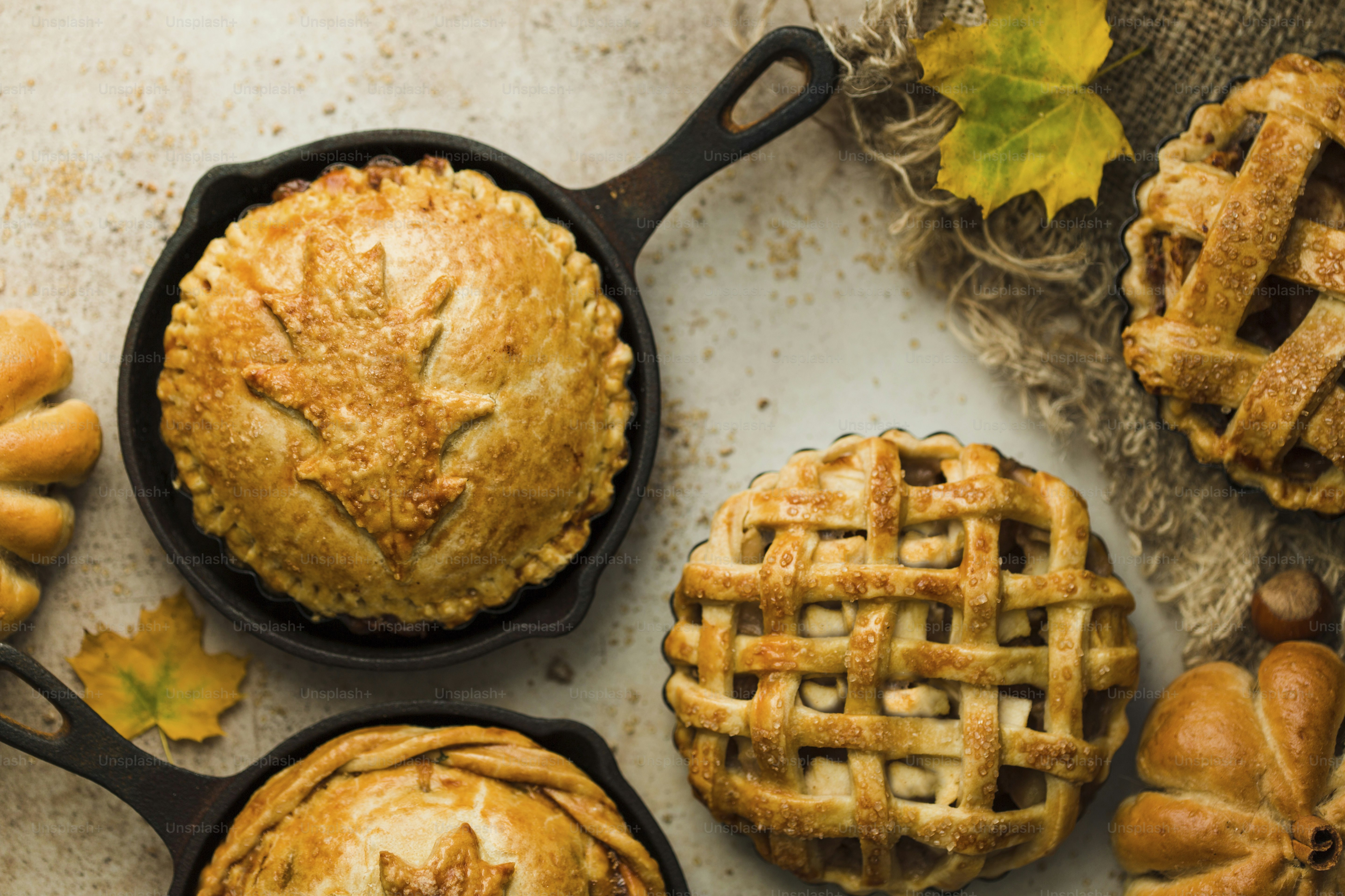 A group of pies sitting on top of a table photo – Food Image on Unsplash