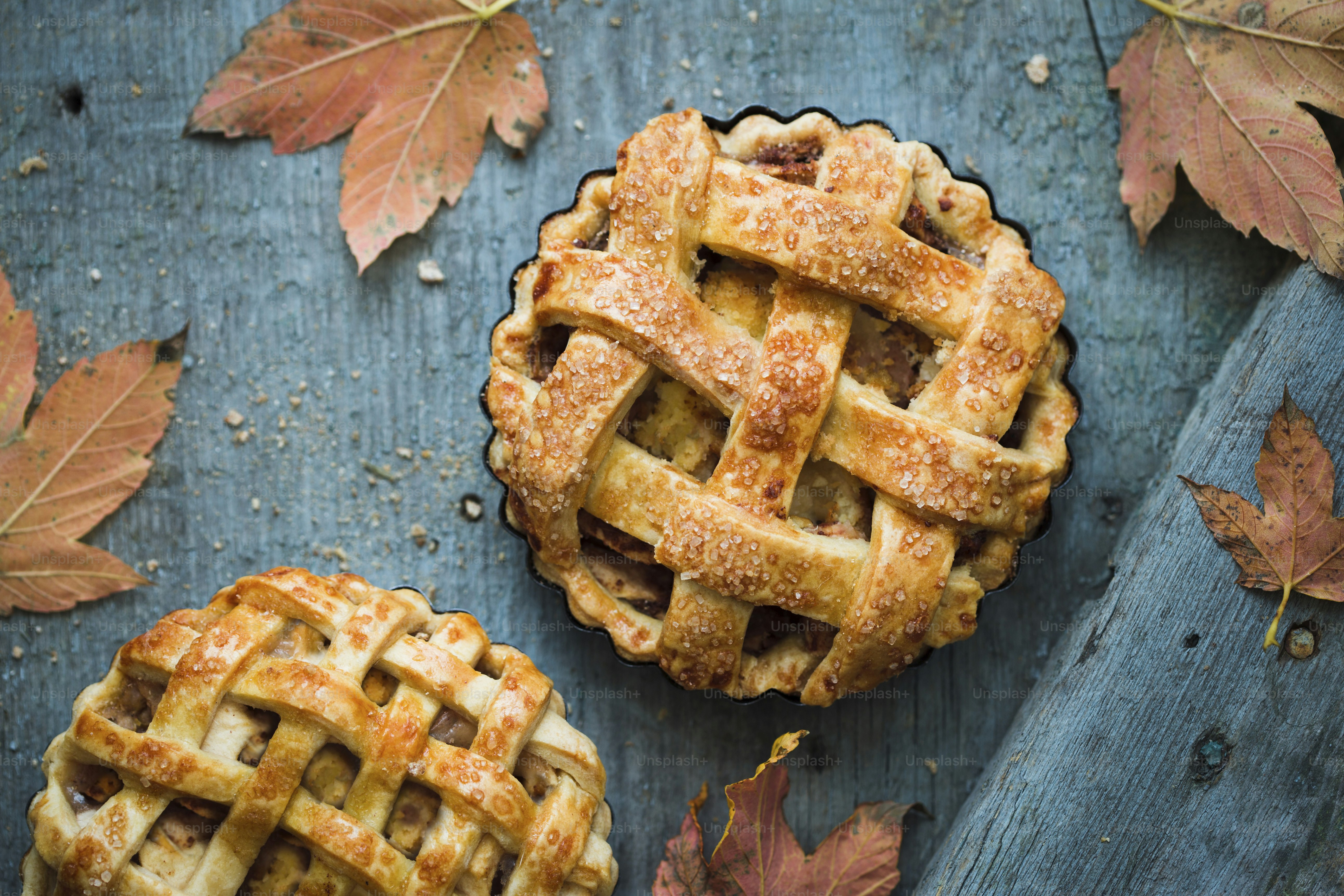 A couple of pies sitting on top of a blue table photo – Autumn recipes ...