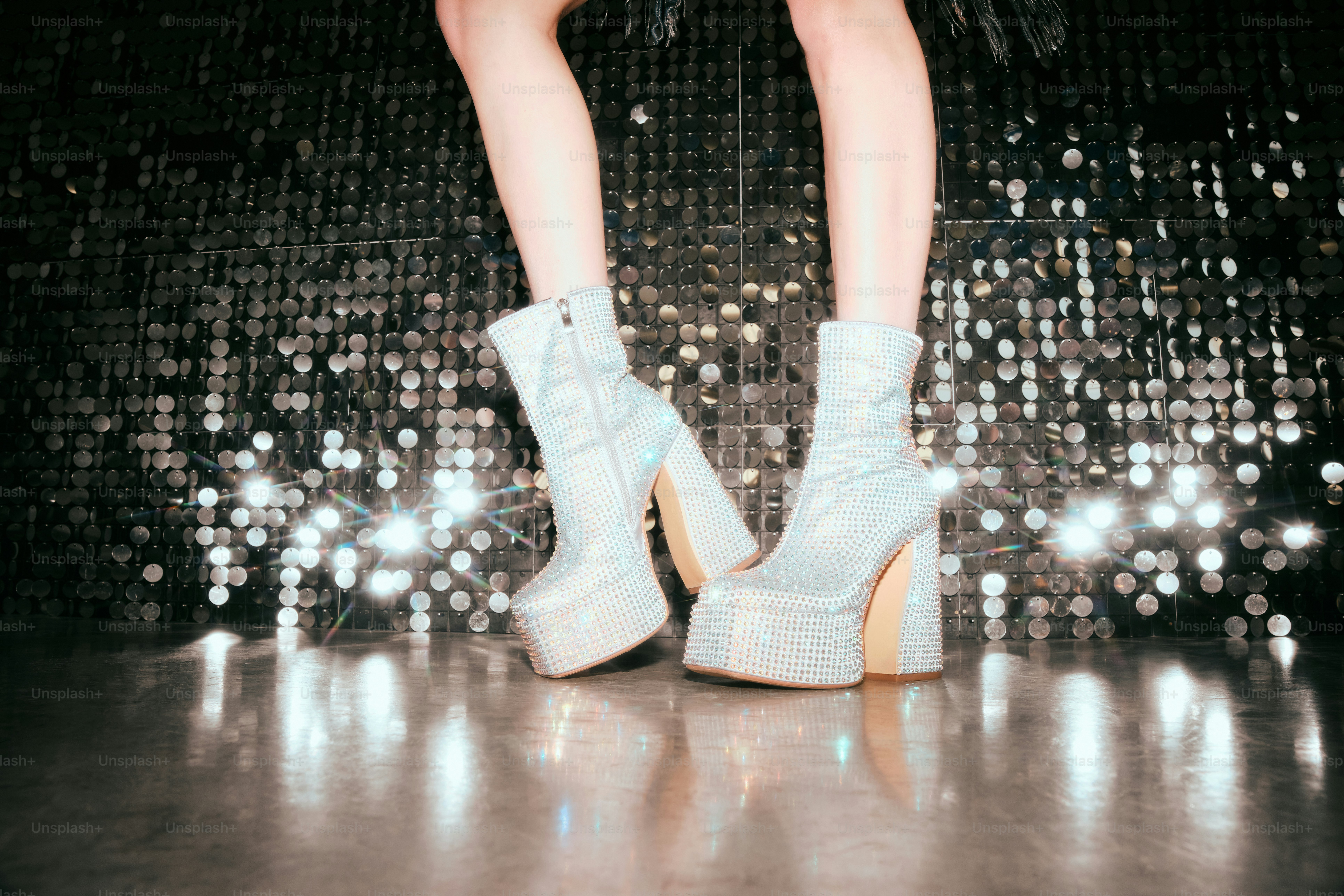 A woman's legs in high heel boots on a stage photo – 90s Image on Unsplash