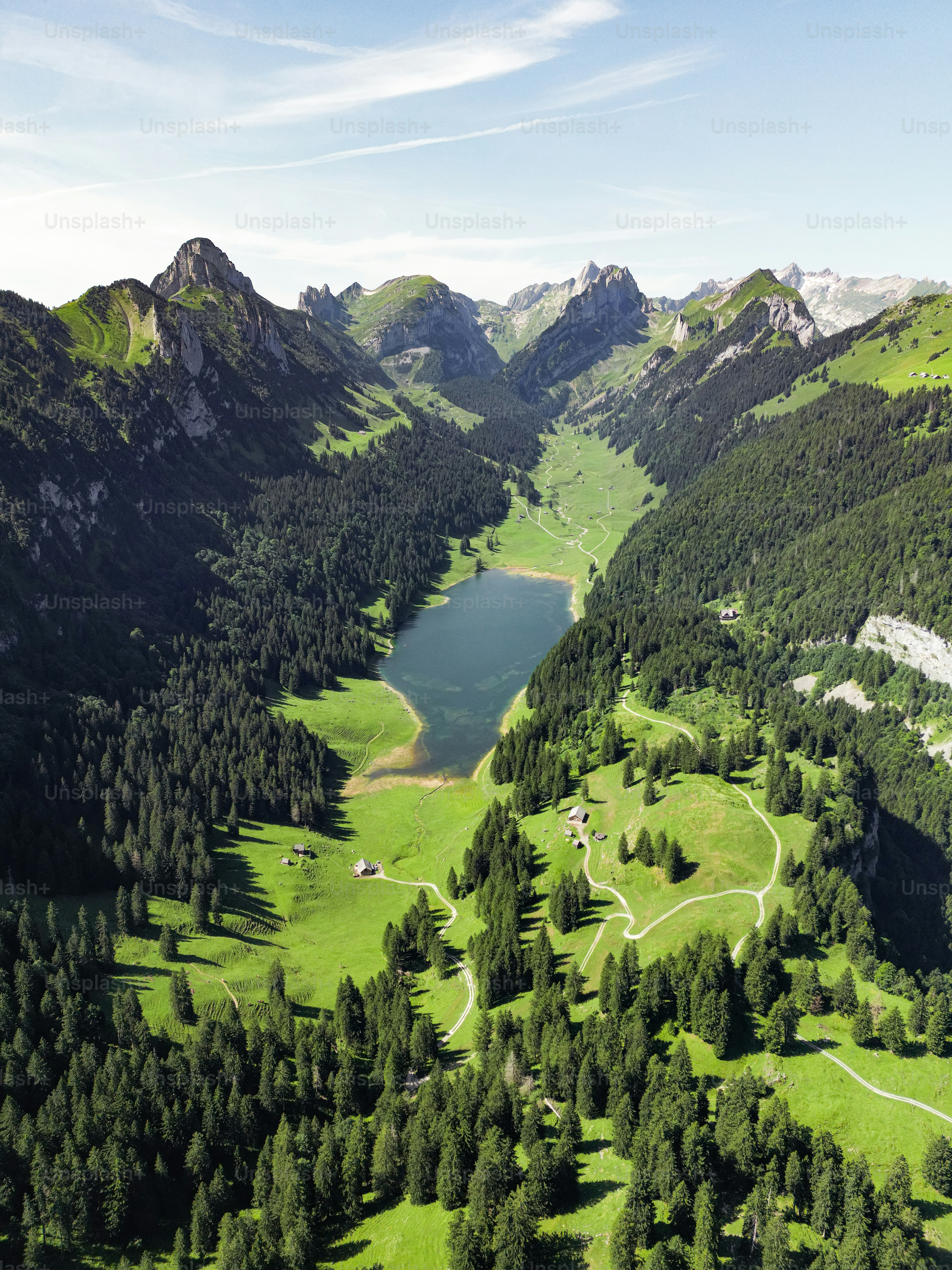 An aerial view of a mountain valley with a lake photo – Travel Image on ...