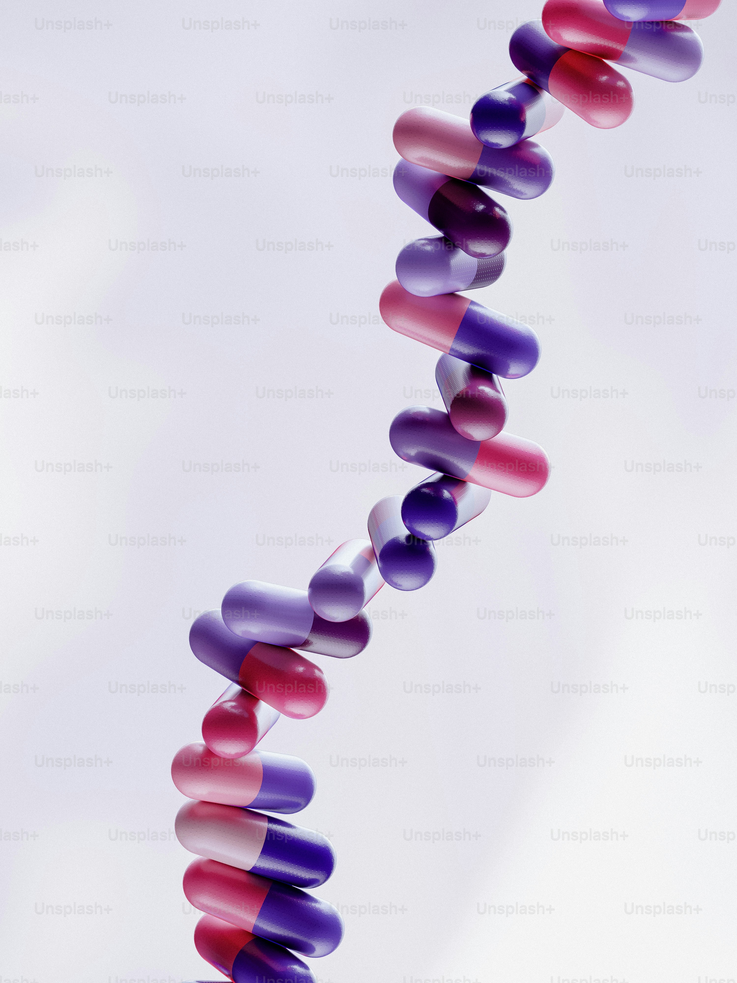 A multicolored strand of beads hanging from a string photo – Medical ...