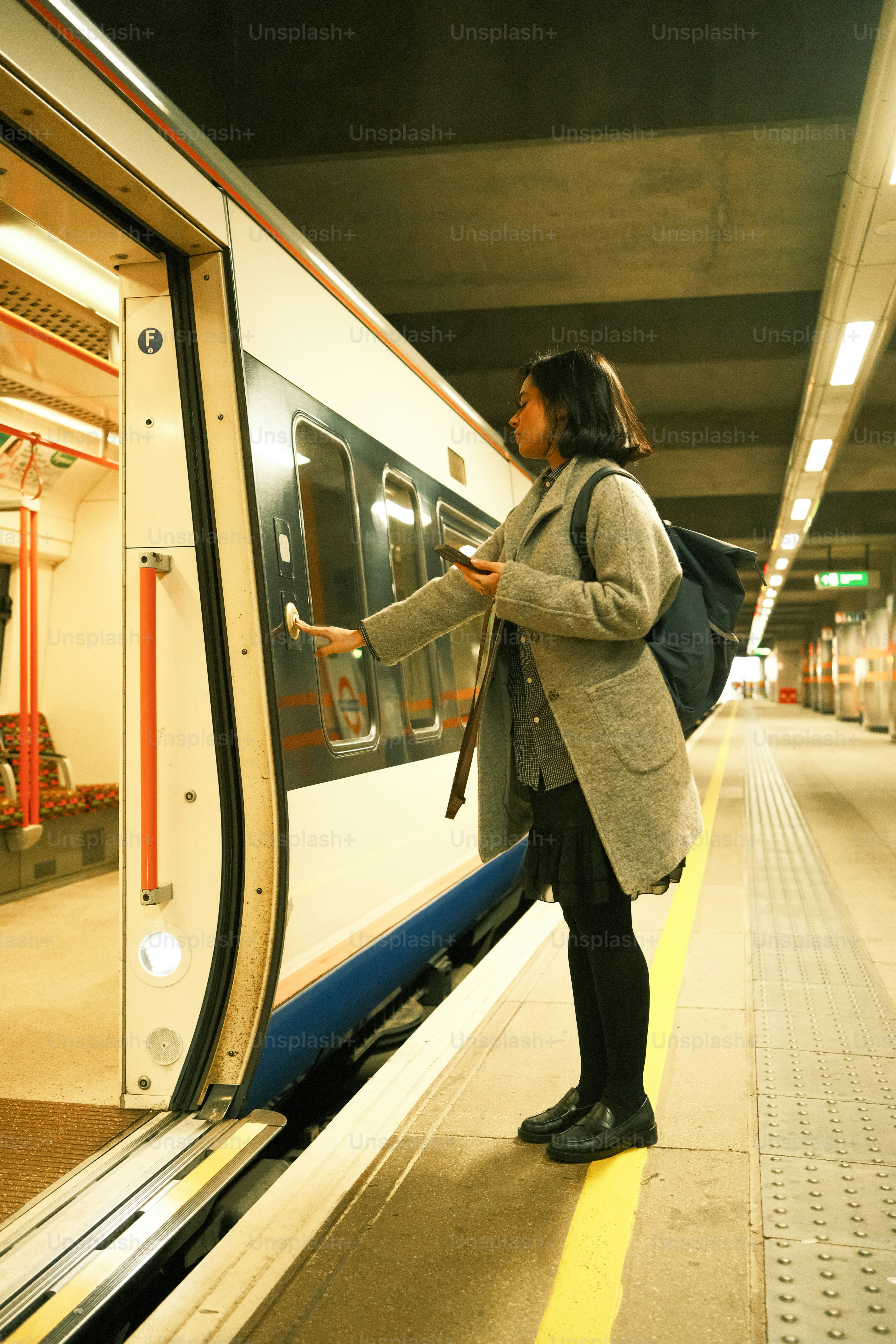 A woman sitting on a train looking up at the sky photo – Travel Image ...