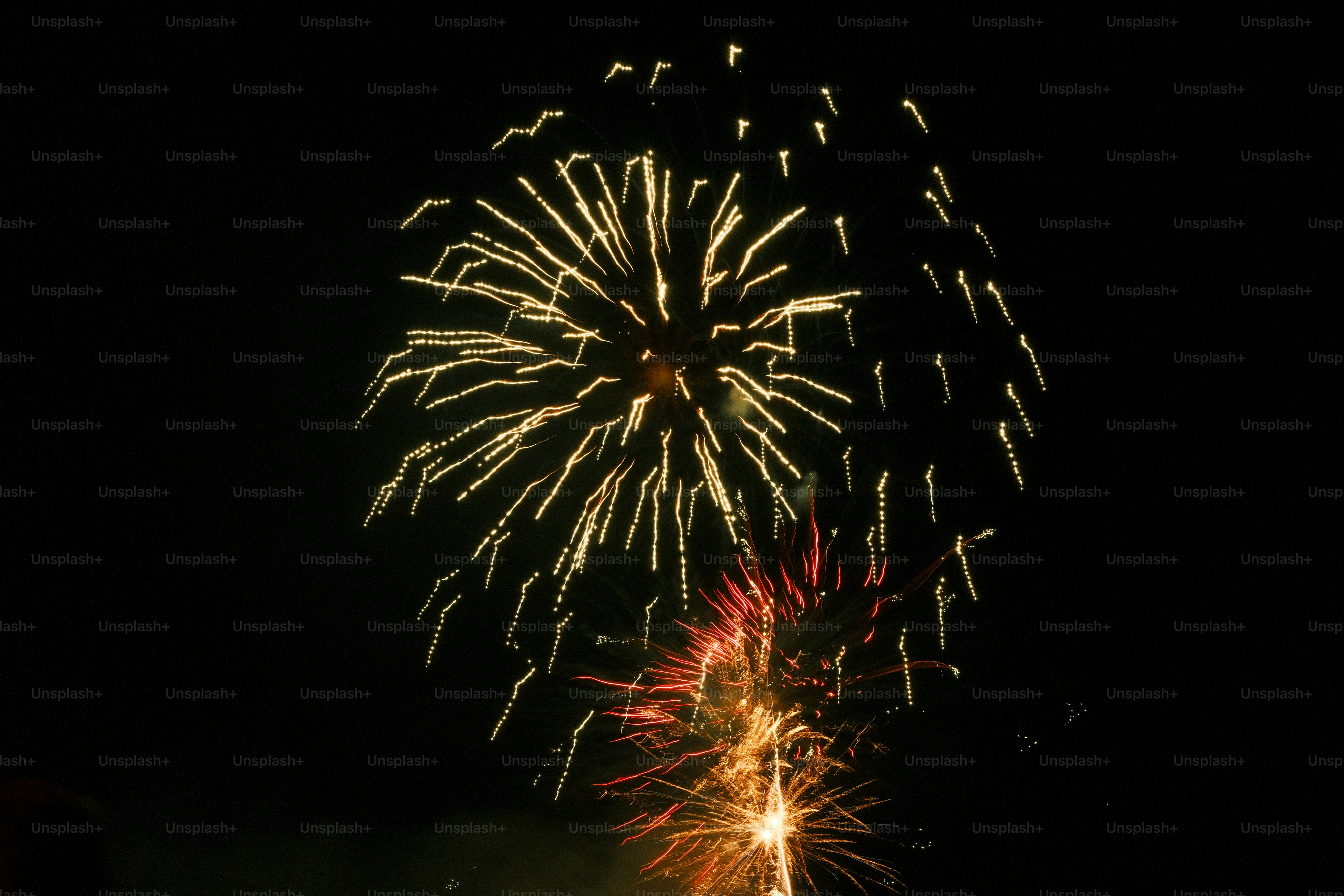 A large fireworks is lit up in the night sky photo – Fireworks Image on ...