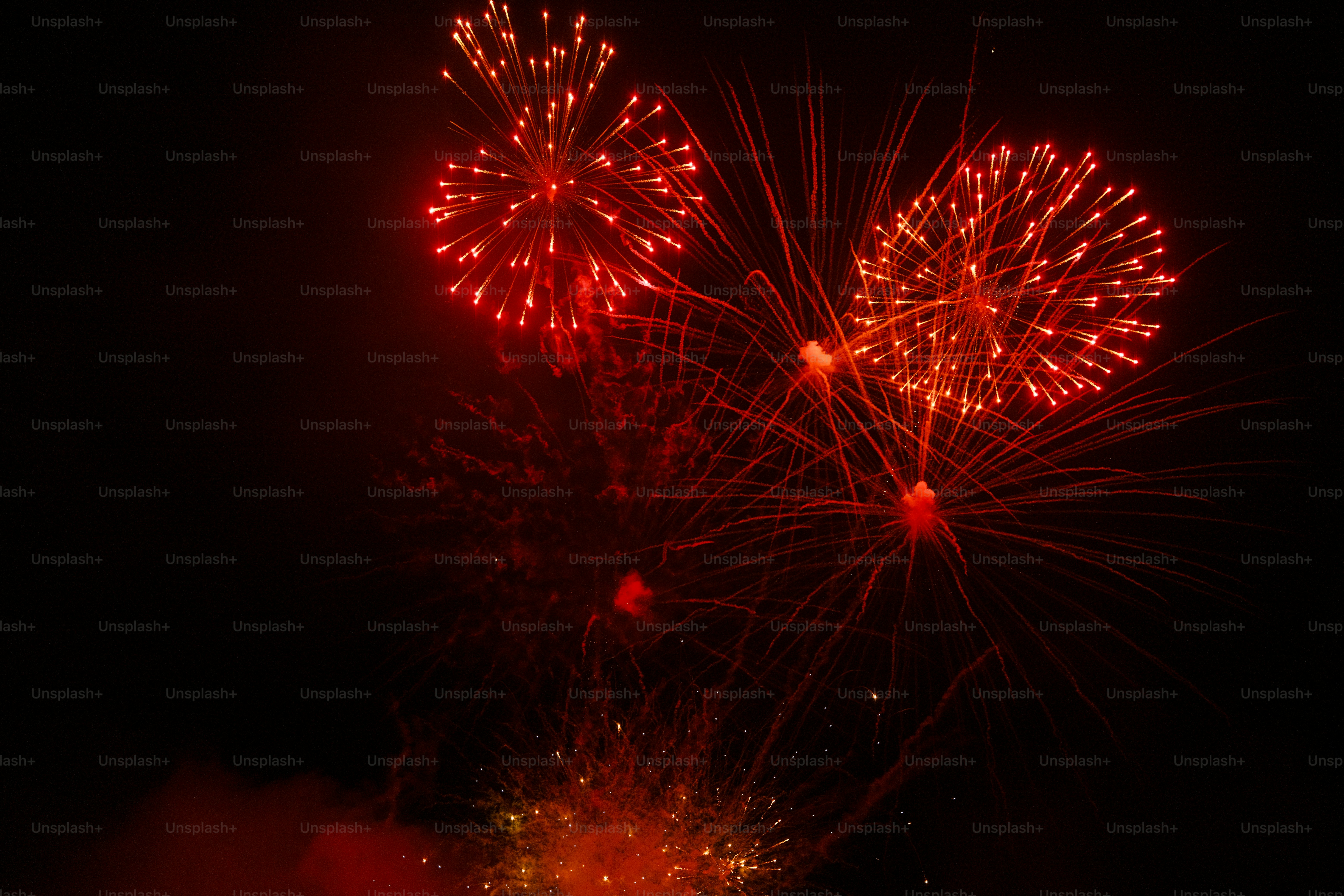 A firework display in the night sky photo – Fireworks Image on Unsplash