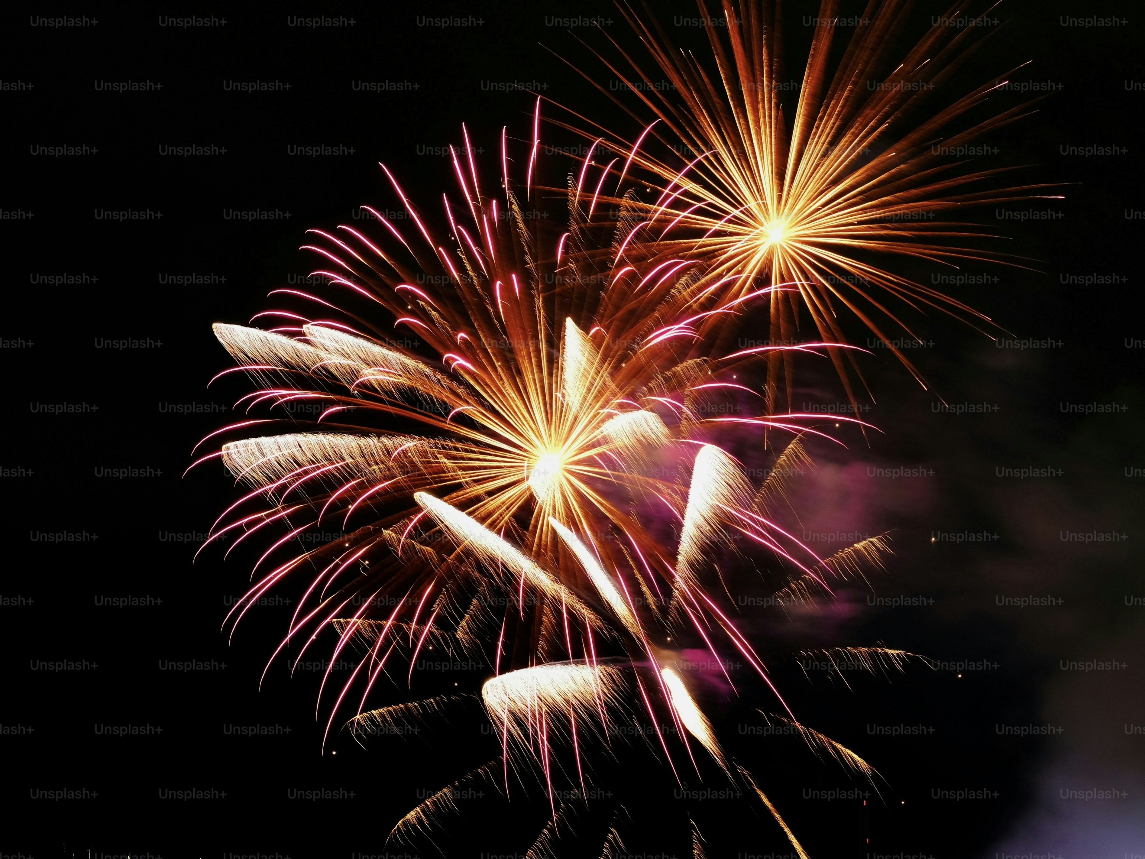 A red and white firework in the night sky photo – Firework display ...