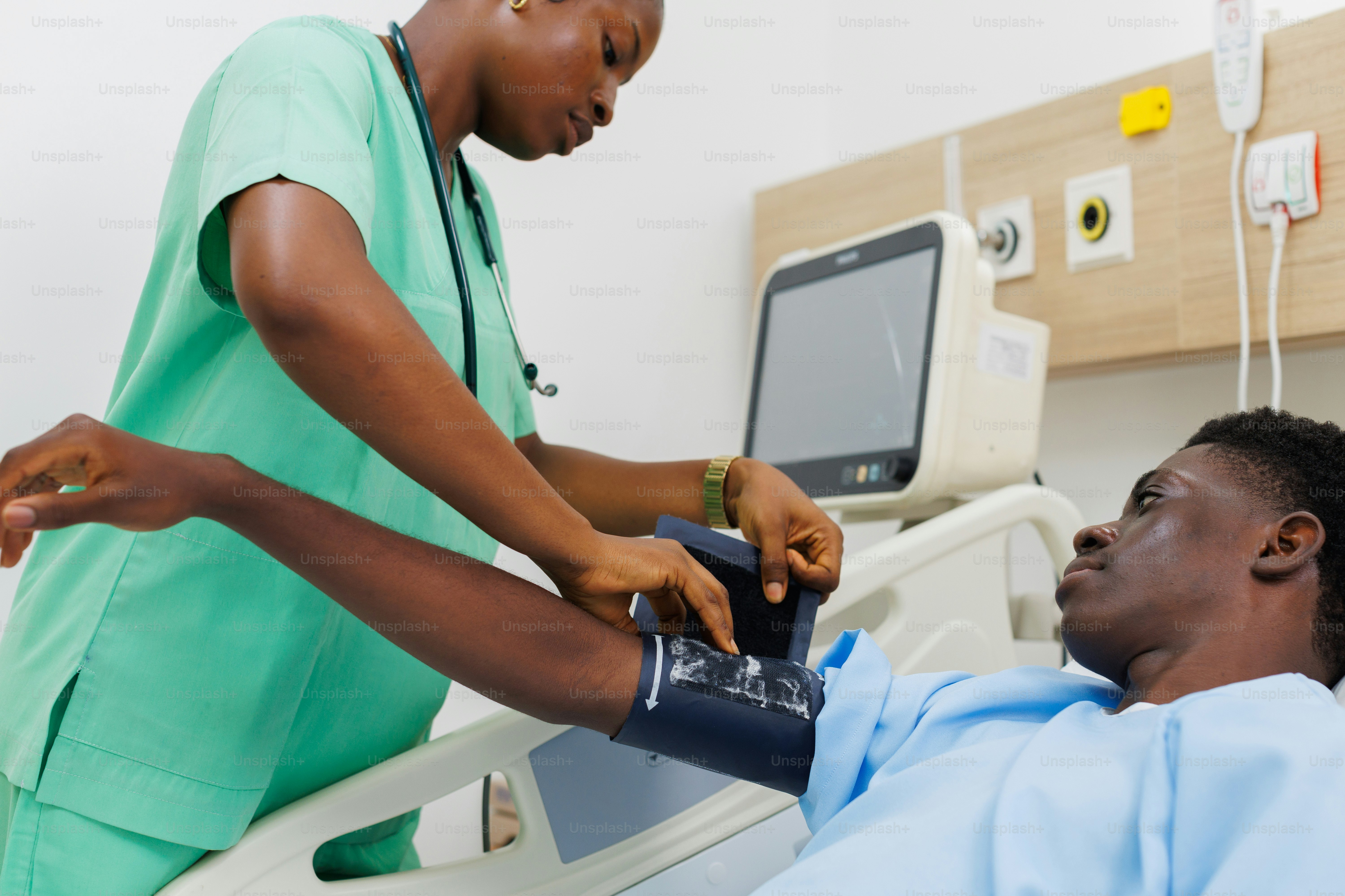A woman in a hospital bed talking to a man in a hospital bed photo ...