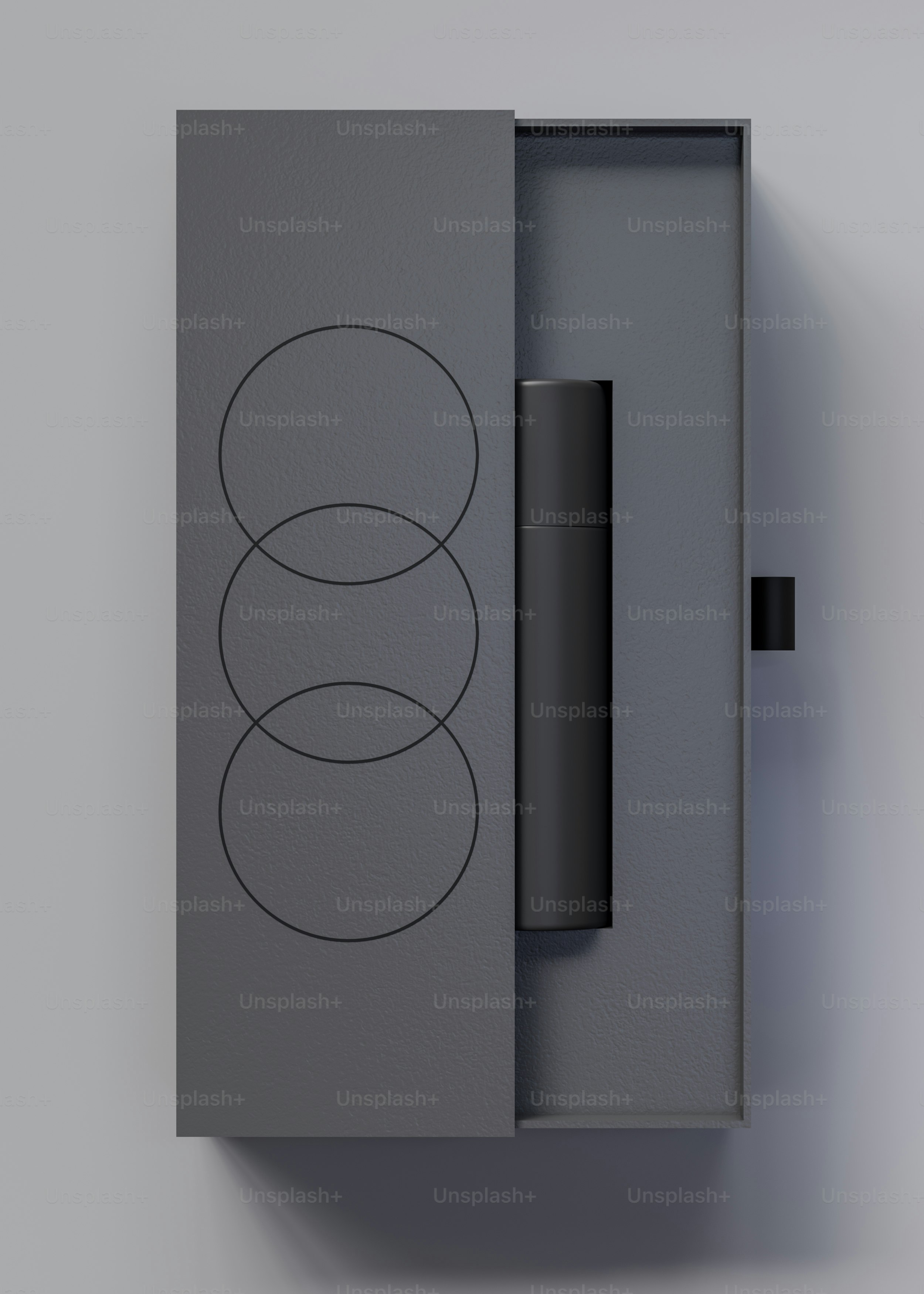 A gray box with a black object inside of it photo – Product Image on ...