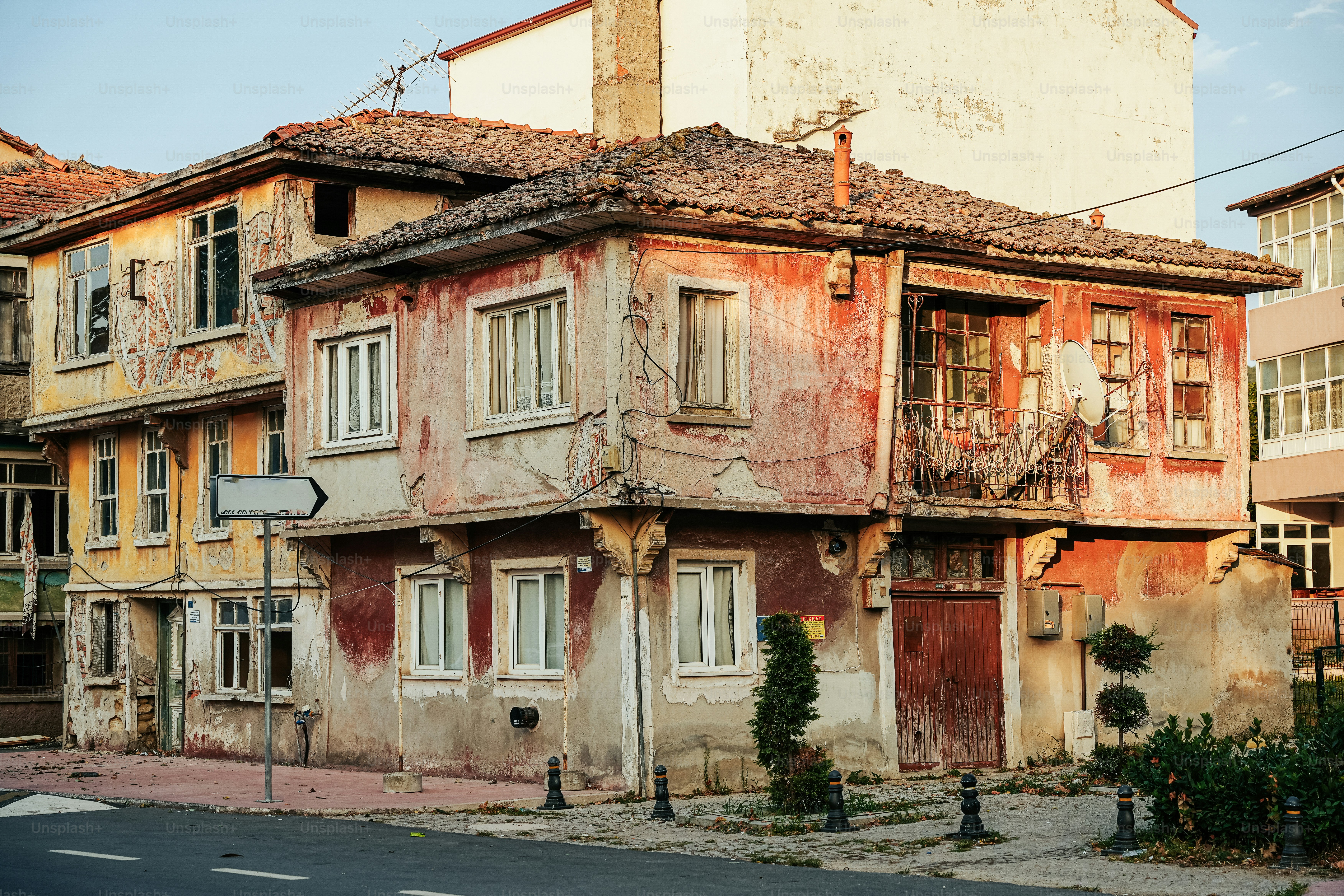 An old run down building on a street corner photo – Urban exploring ...