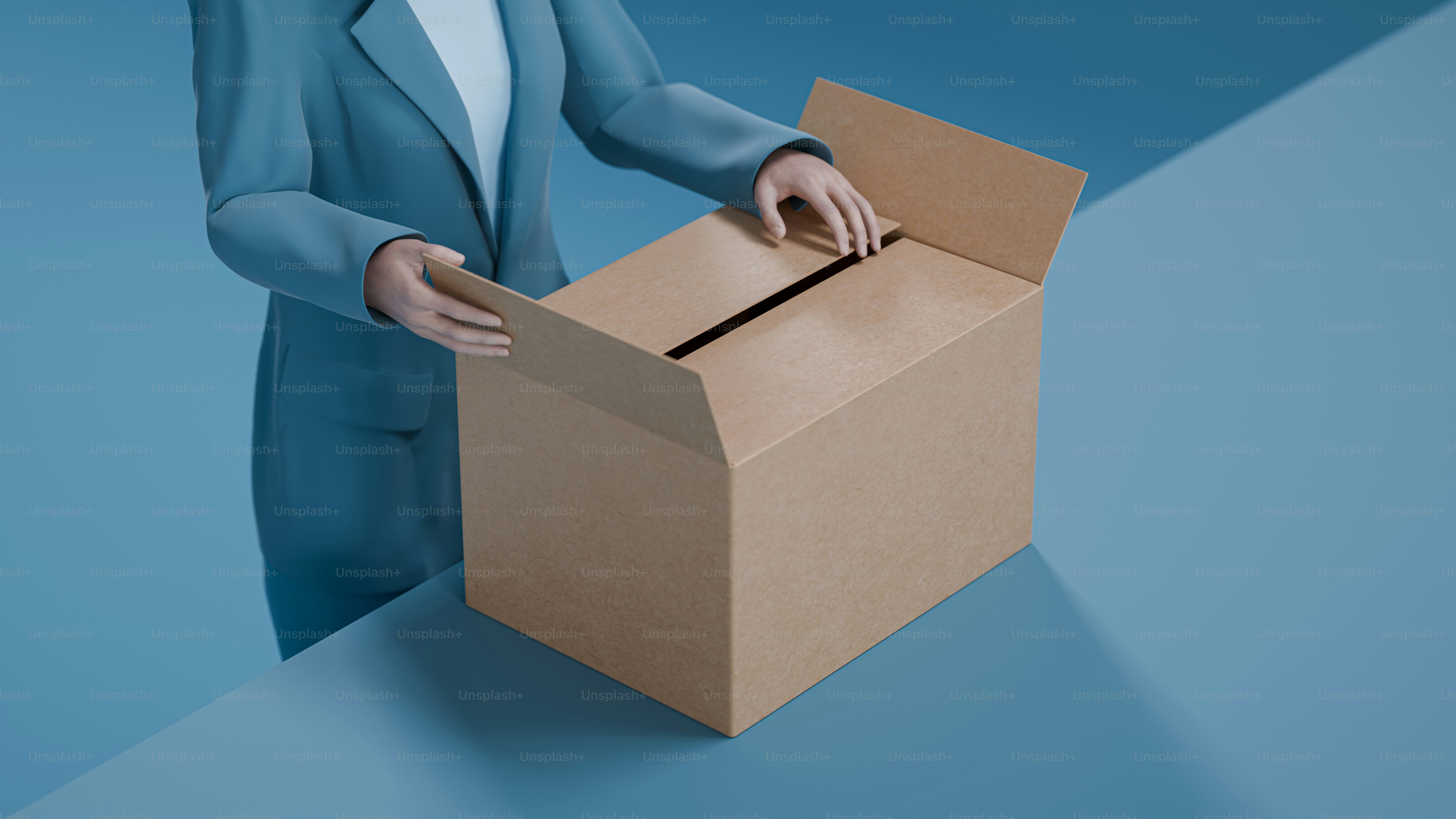 A woman in a business suit is opening a box photo – Product Image on ...