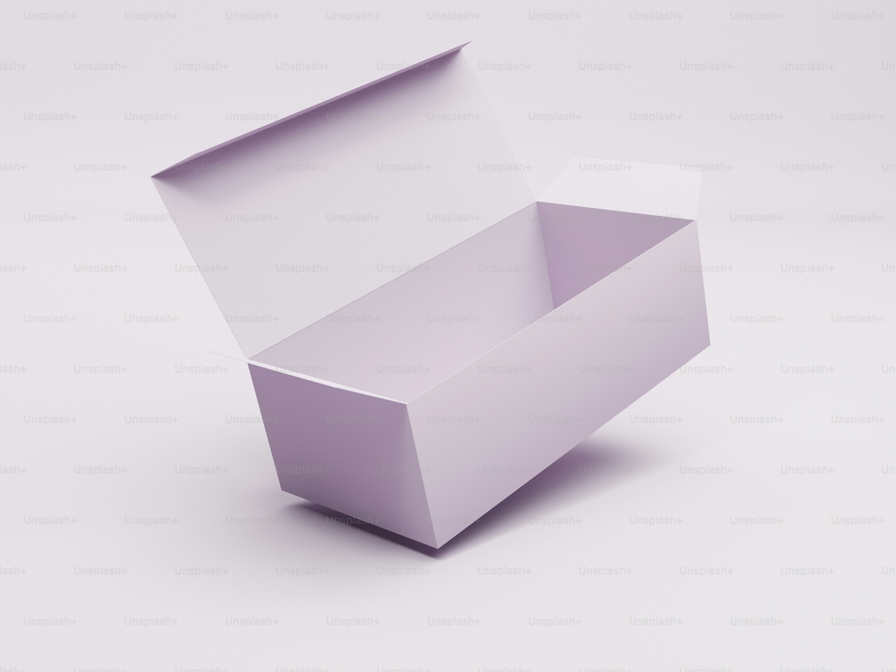 A white box that is open on a white surface photo – Product Image on ...