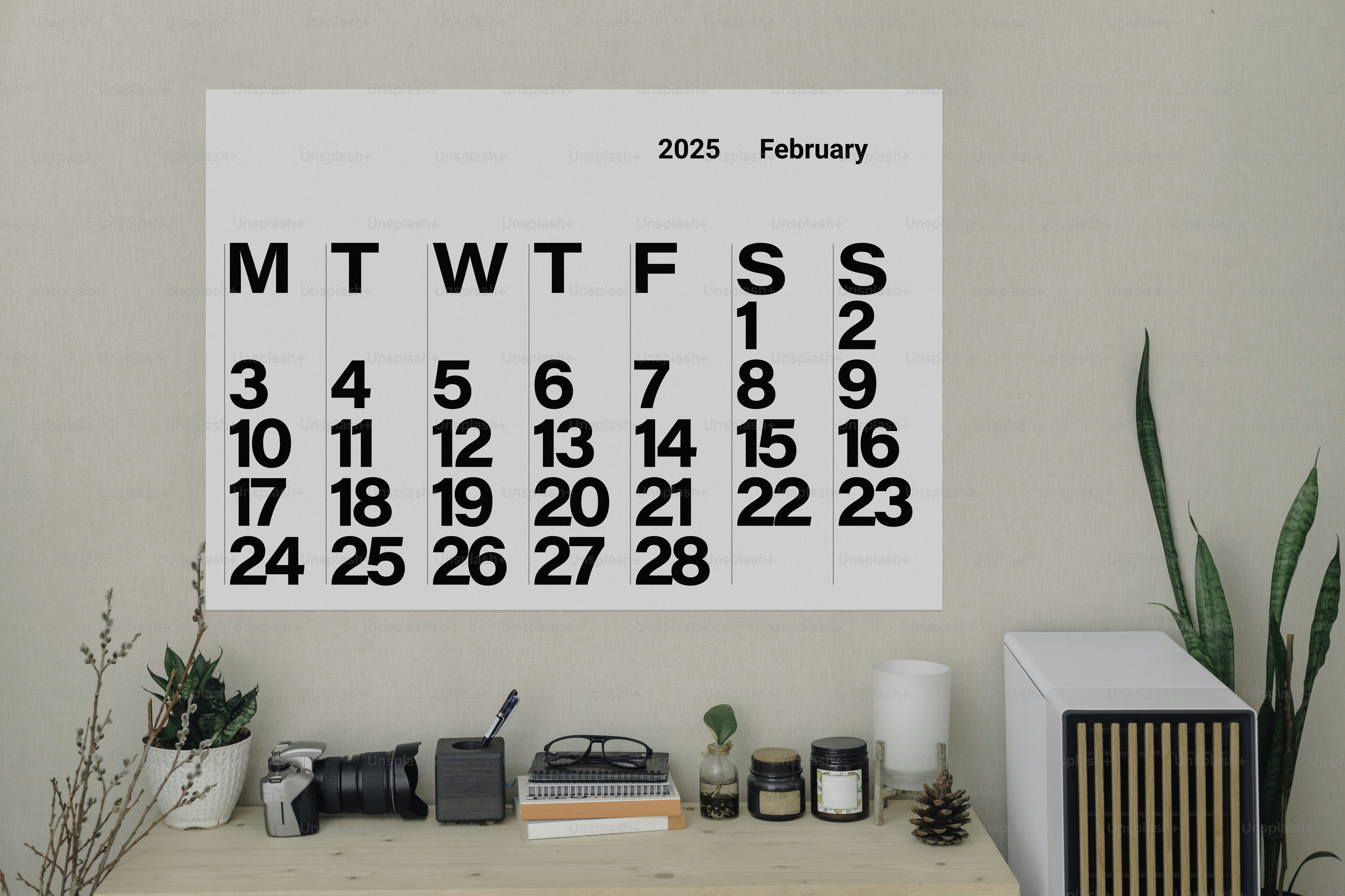 A desk with a calendar hanging on the wall photo – Calendar Image on ...