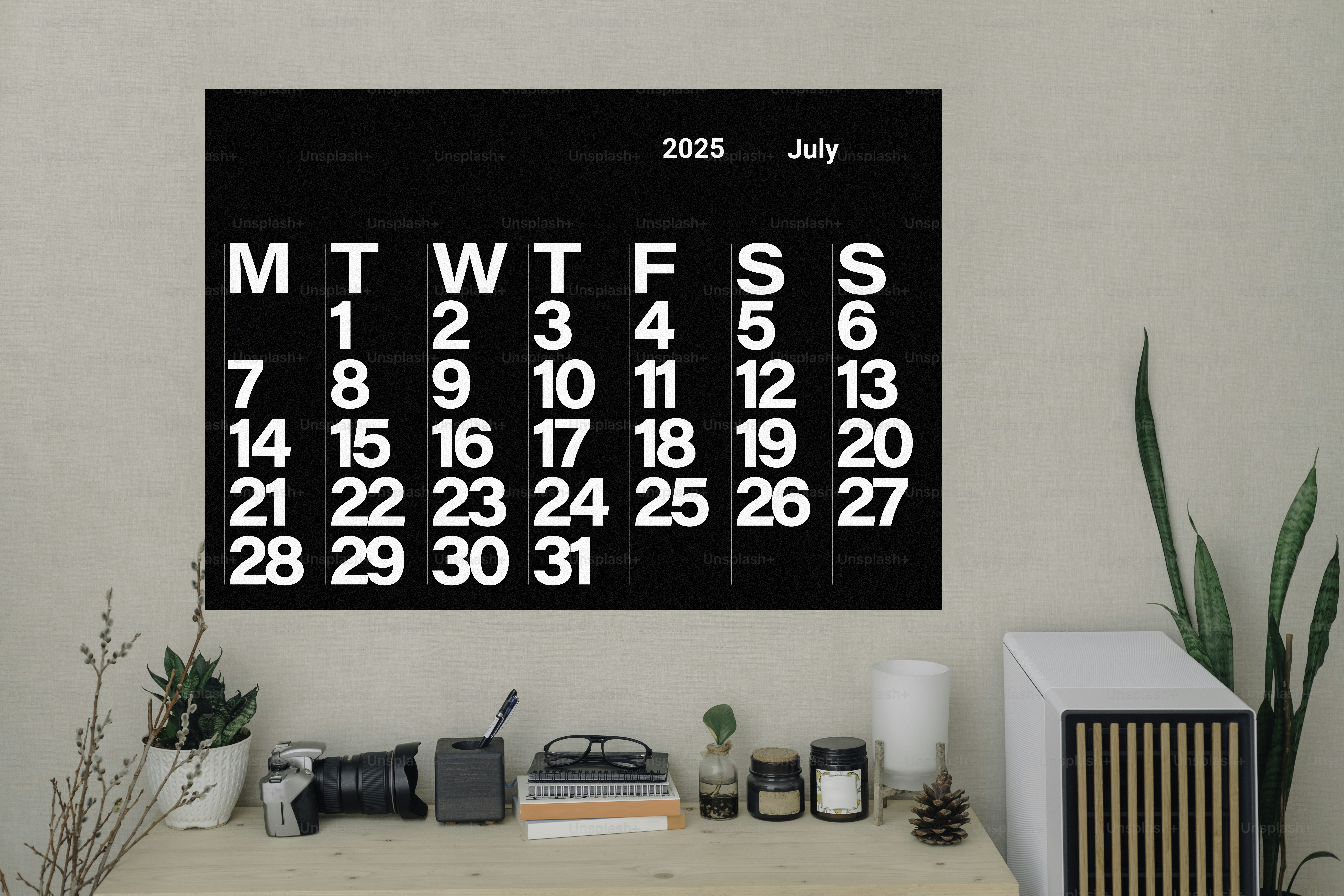 A black and white calendar hanging on a wall photo – Graphic design ...