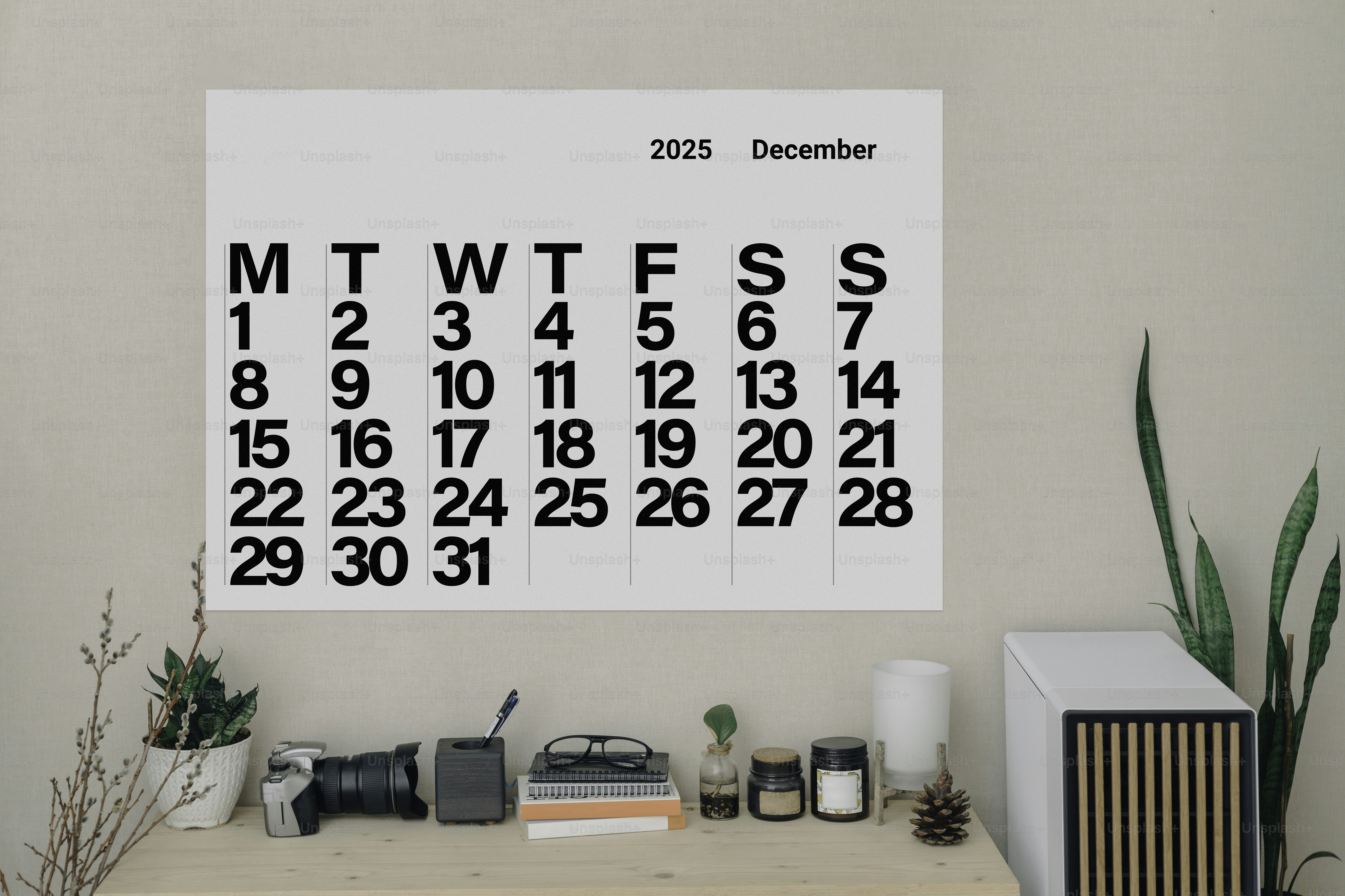 A black and white calendar hanging on a wall photo – Graphic design ...