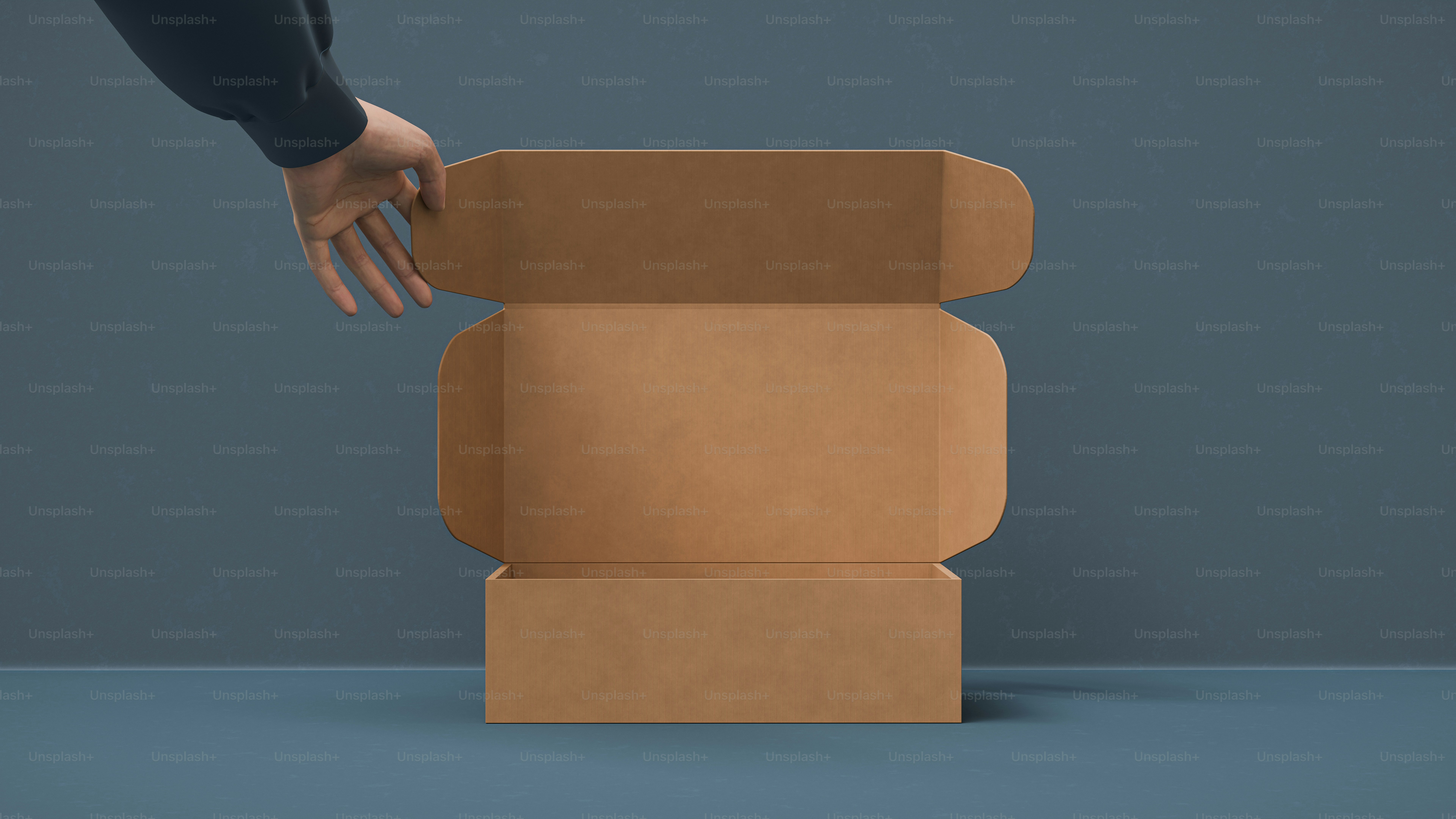 A hand reaching for a cardboard box on a table photo – Mockup Image on ...
