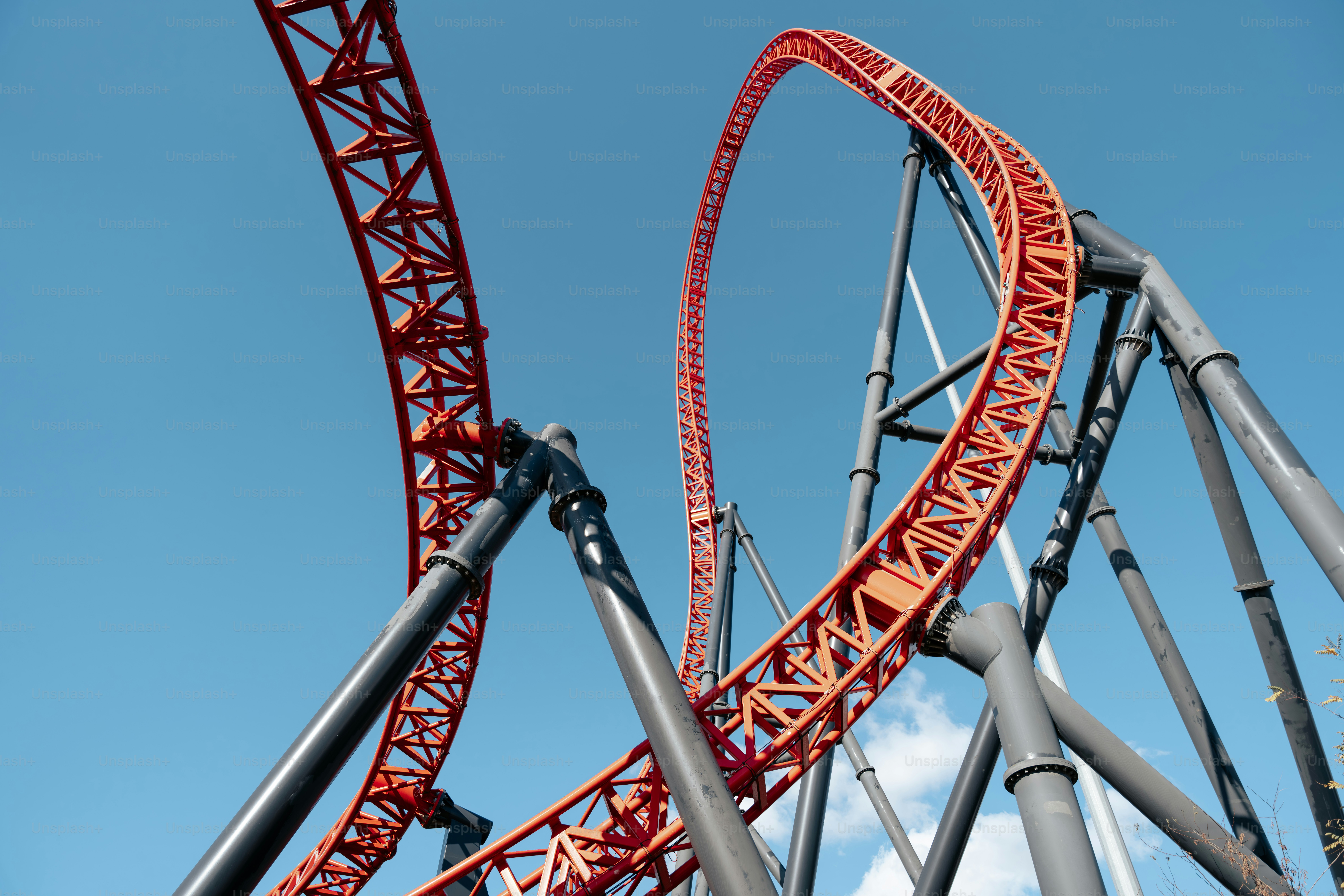 A roller coaster going through the air on a sunny day photo ...