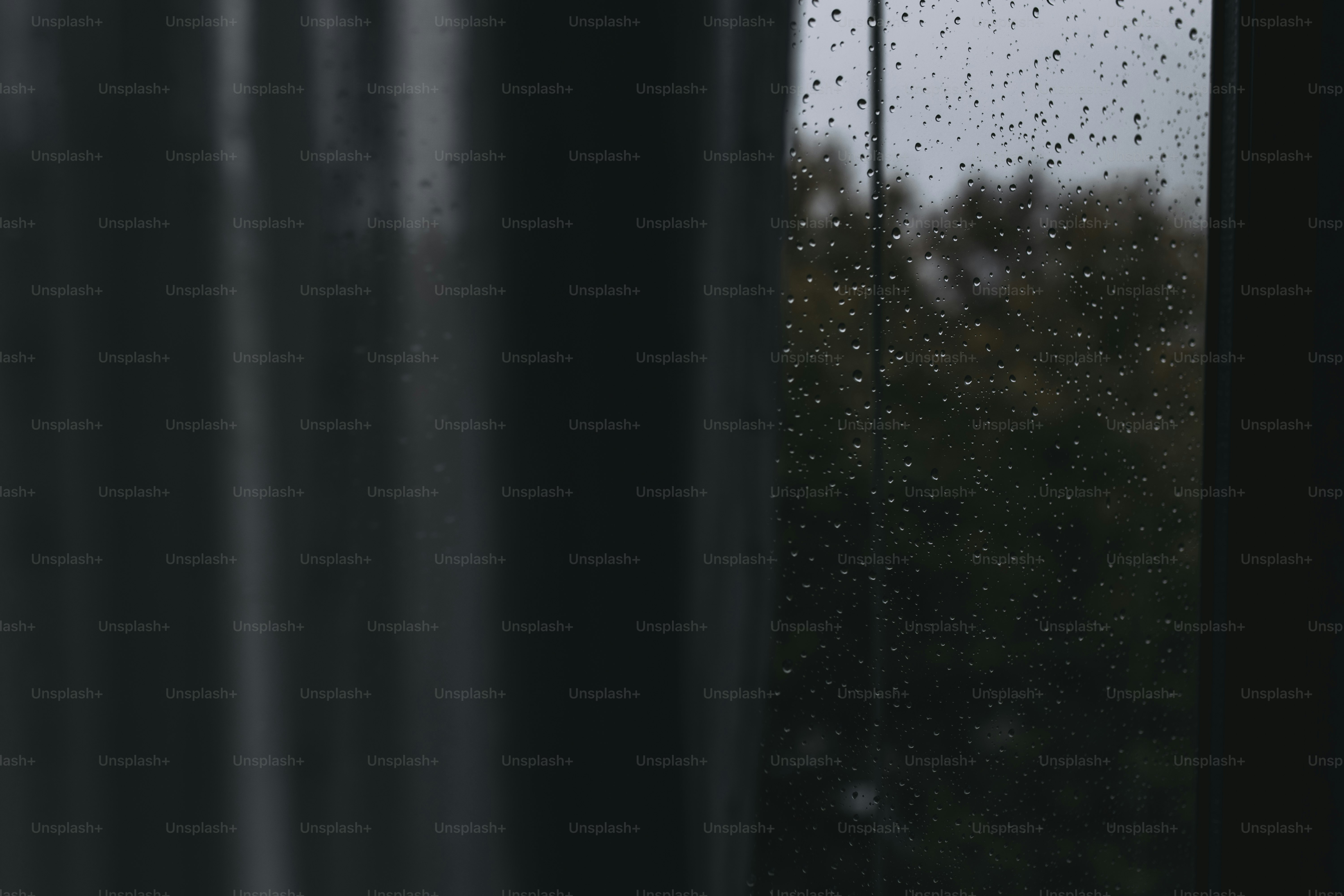 A window with rain drops on the glass photo – Dark Image on Unsplash