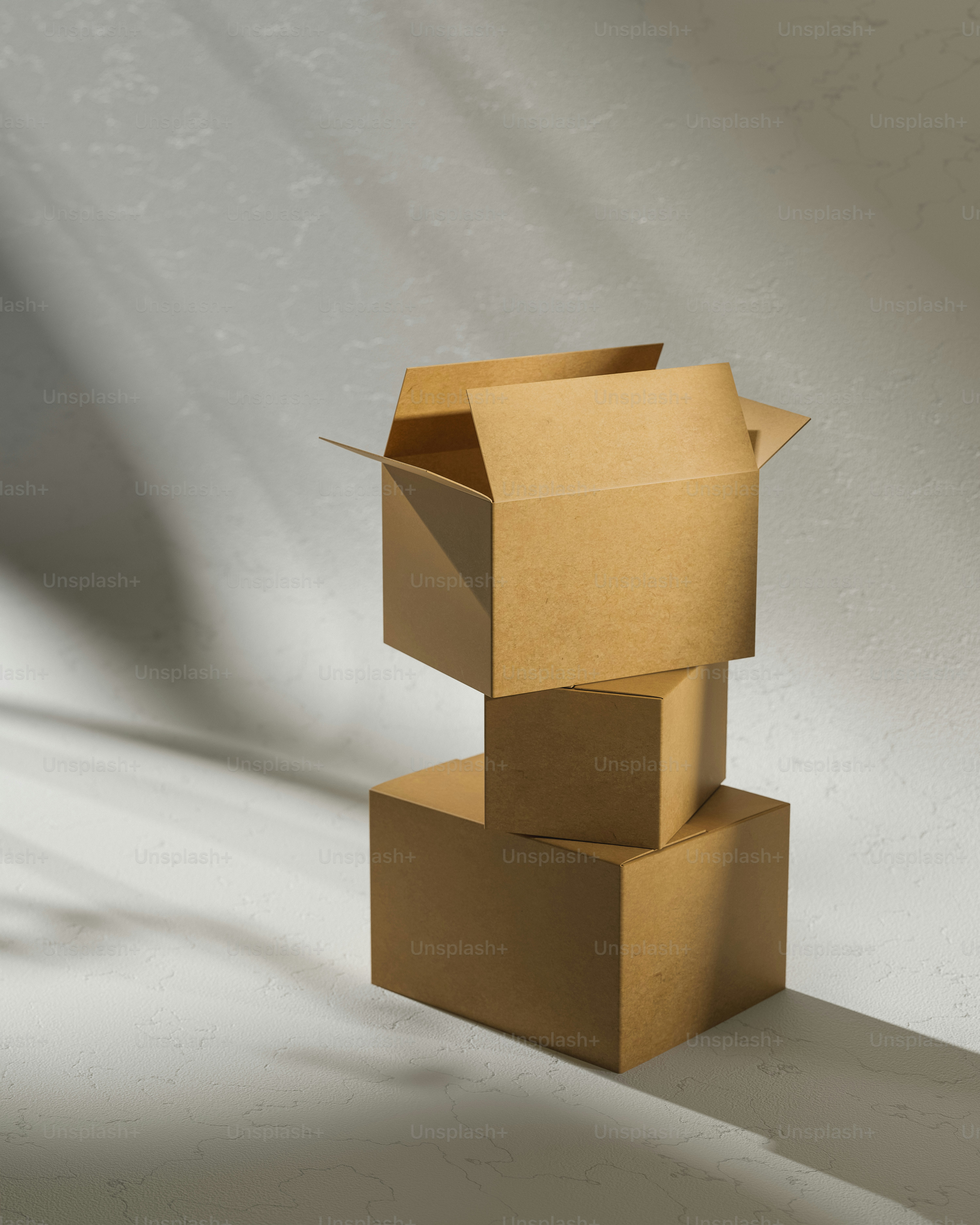 Three cardboard boxes stacked on top of each other photo – Box Image on ...
