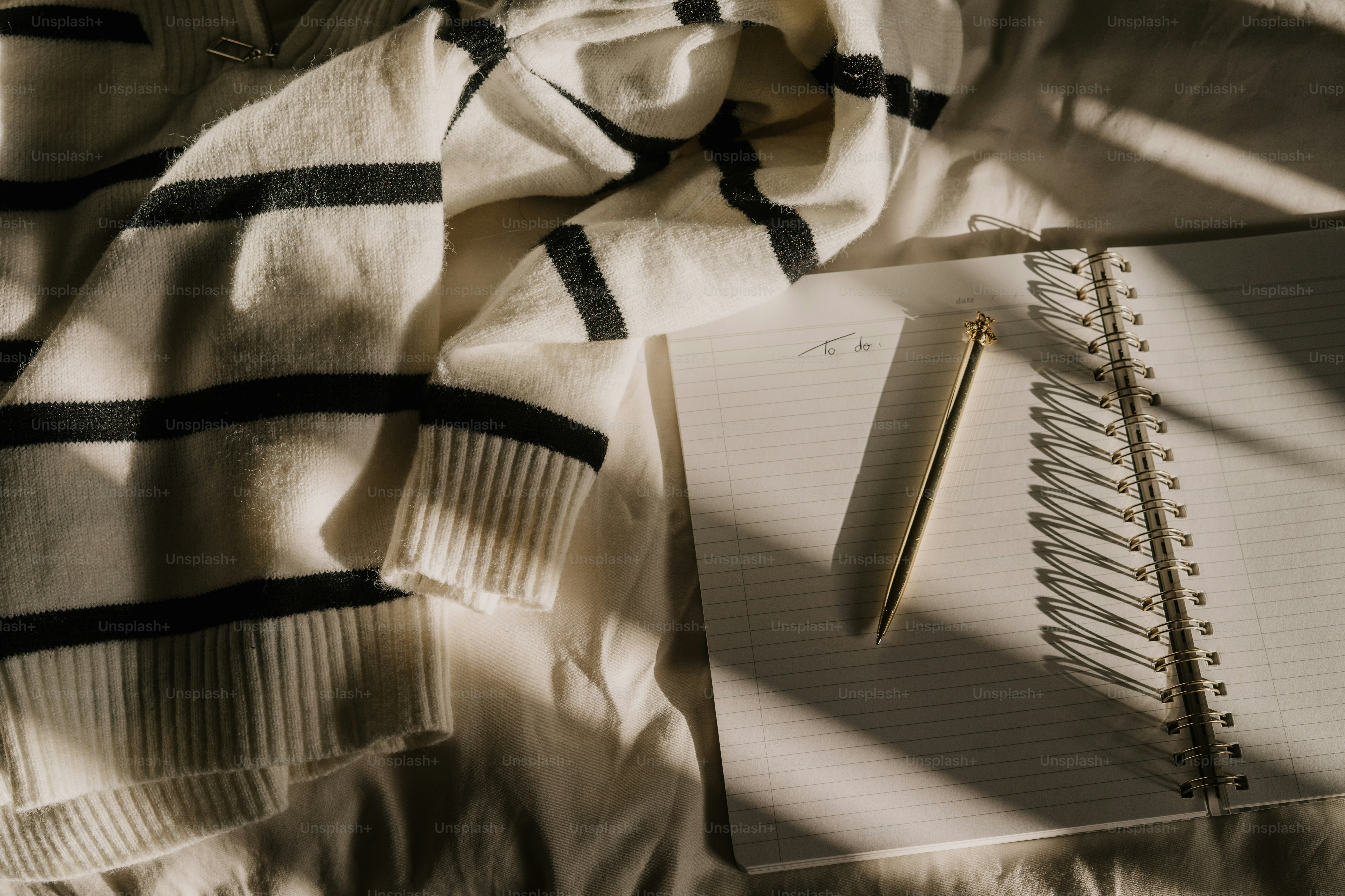 An open notebook and a pen on a bed photo – Notebook Image on Unsplash