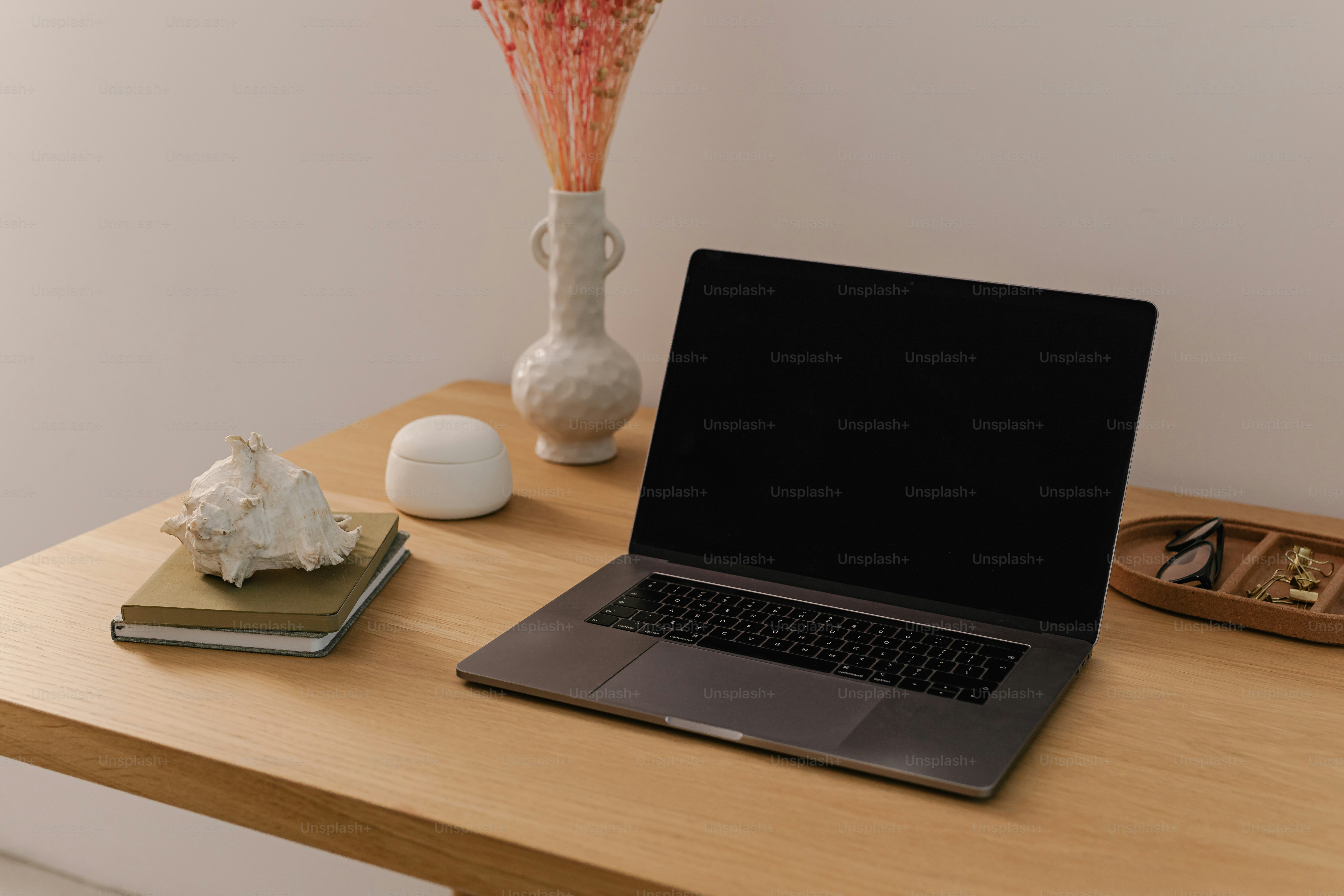 A laptop computer sitting on top of a wooden desk photo – Interior ...