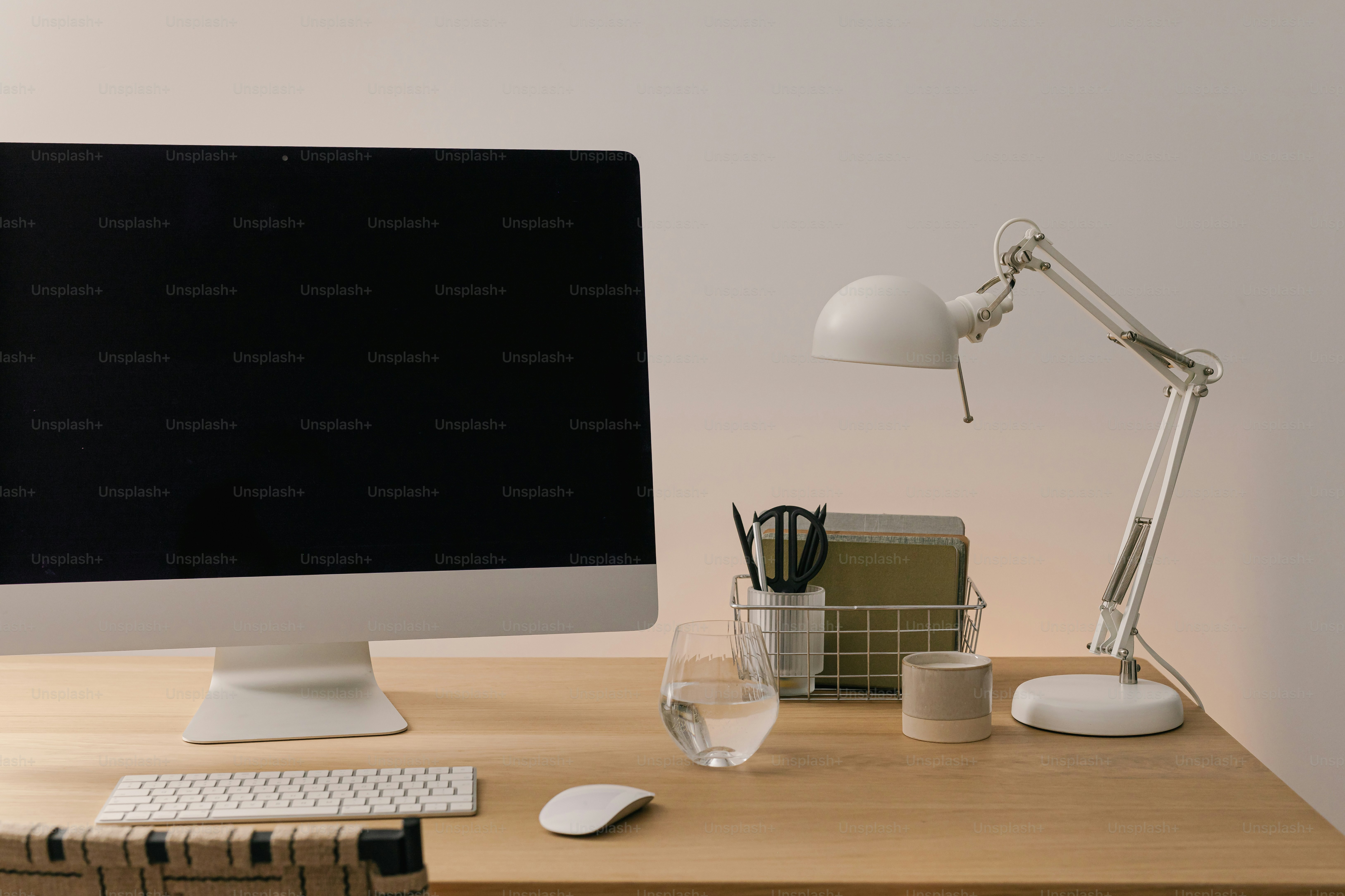 A computer monitor sitting on top of a wooden desk photo – Remote working Image on Unsplash