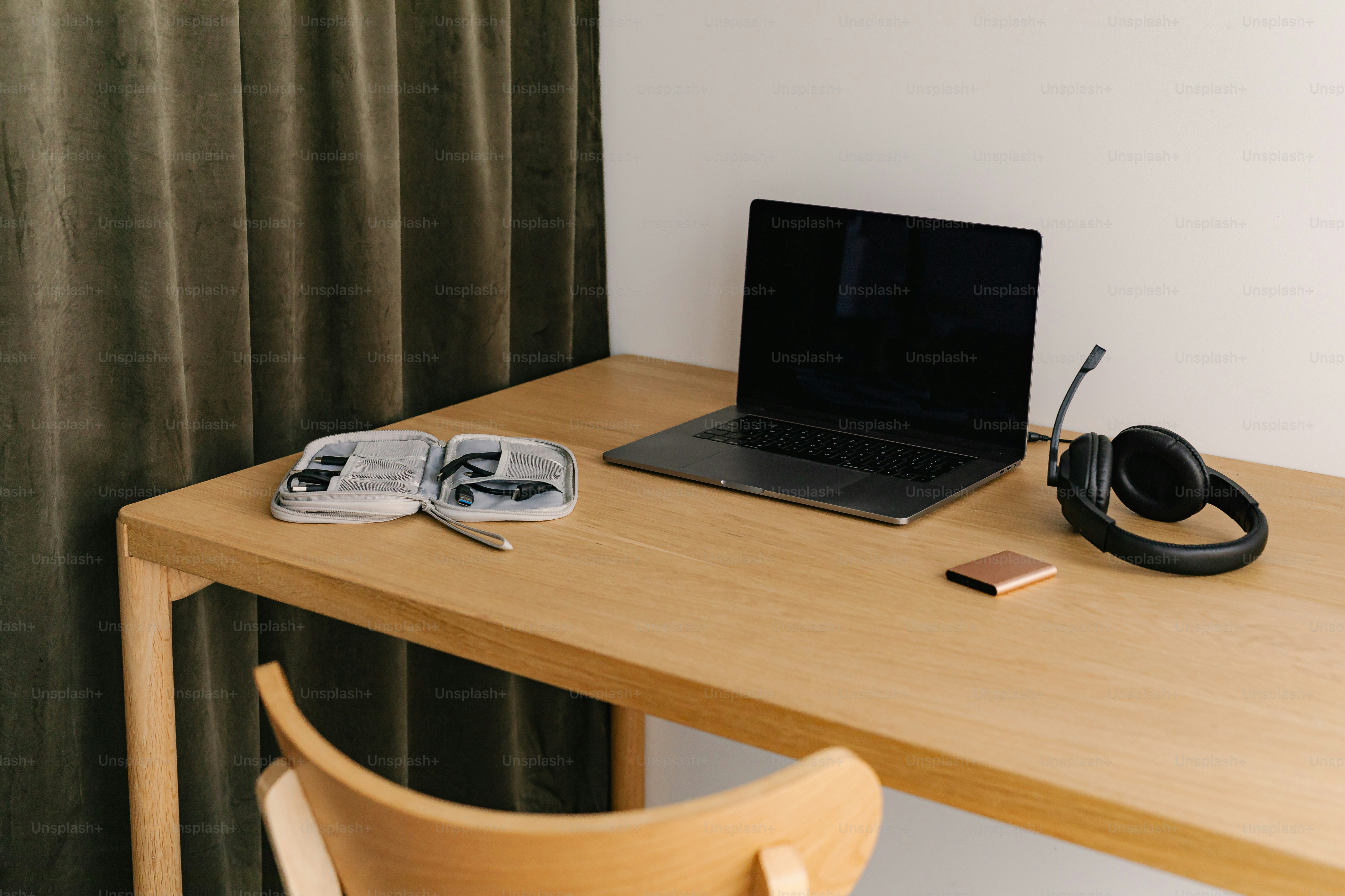 A laptop computer sitting on top of a wooden desk photo – Business ...