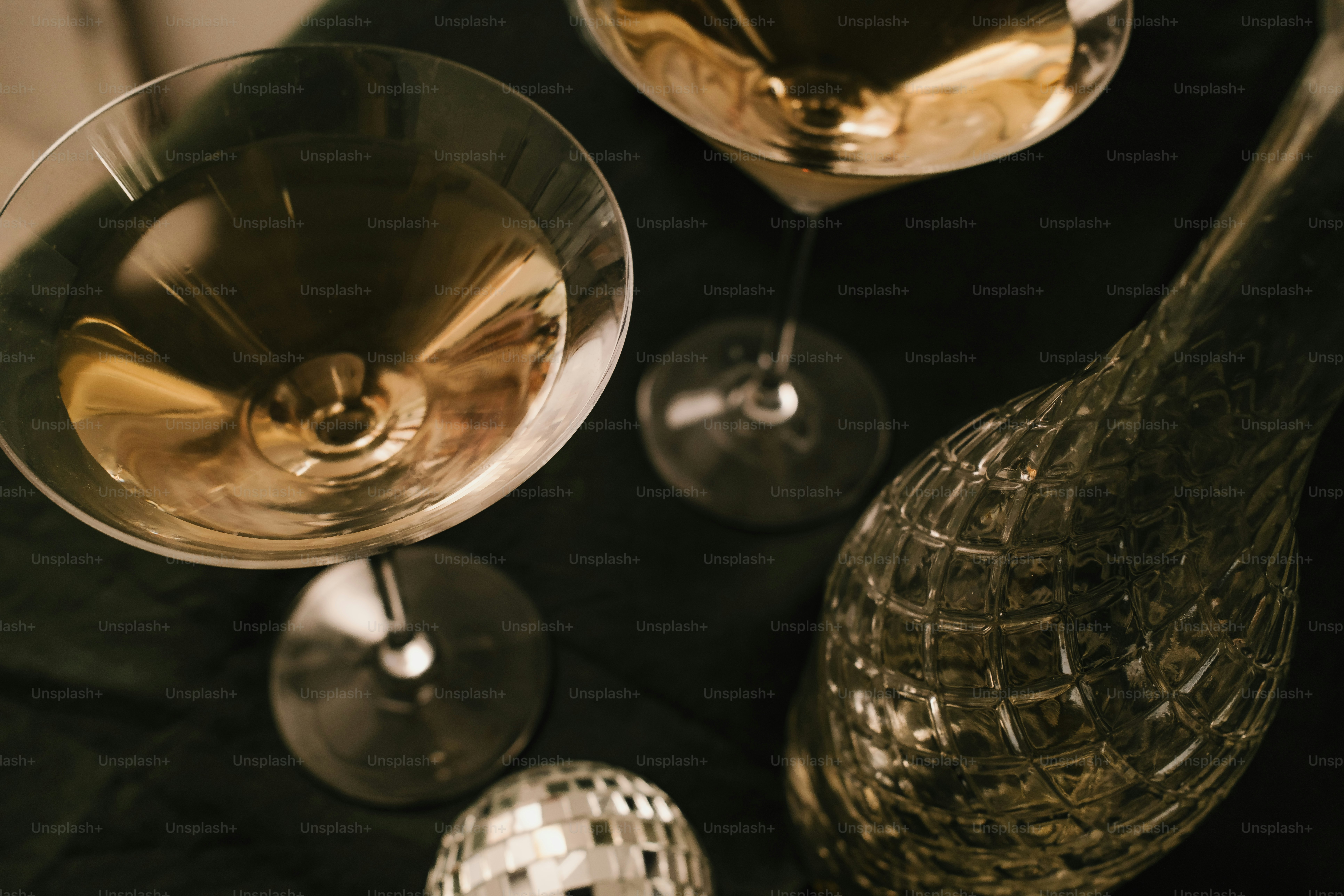 A table topped with two glasses of wine photo – Darkness Image on Unsplash