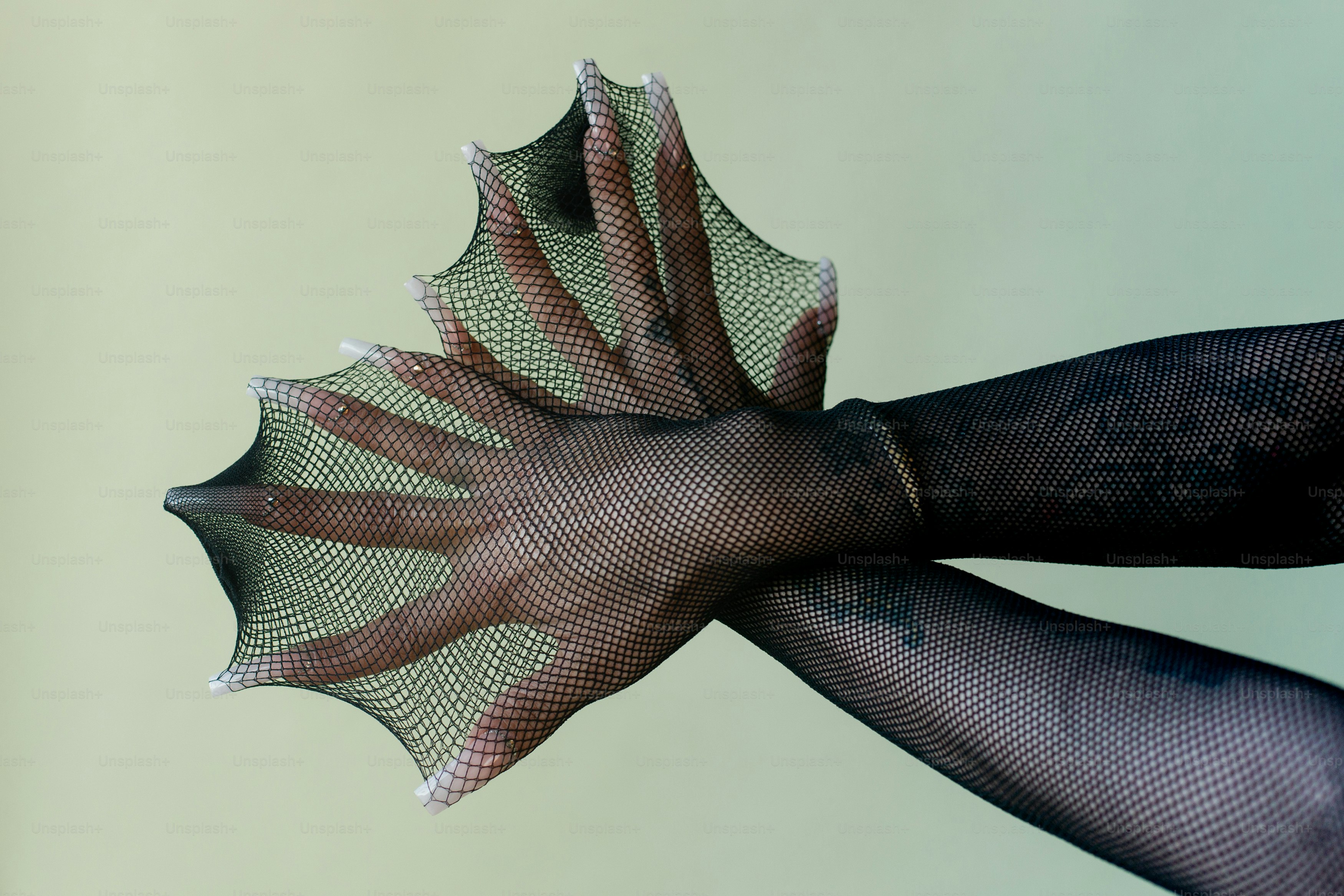 A woman's arm with a net covering it photo – Hands Image on Unsplash
