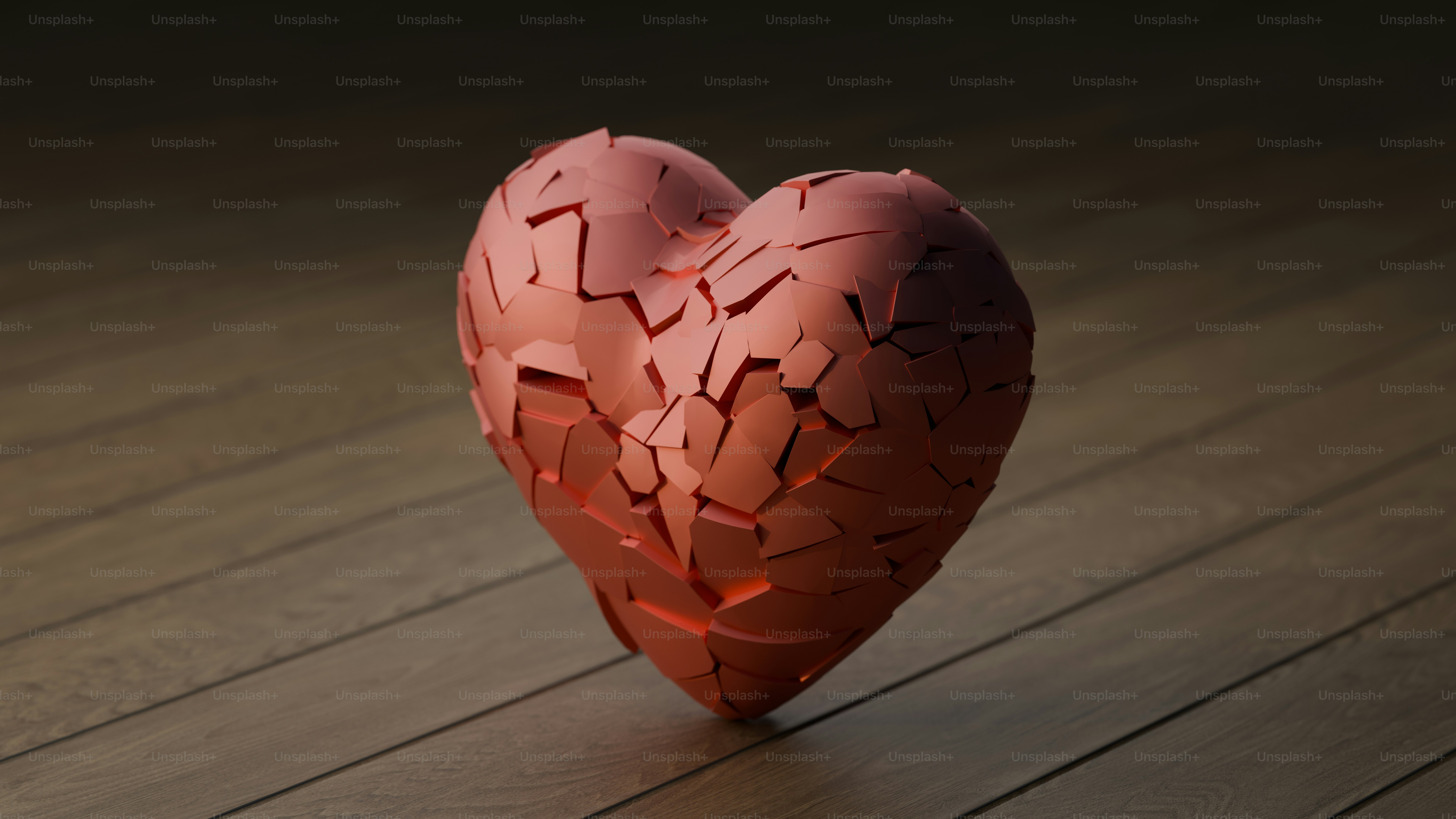 Un corazón roto sentado encima de un suelo de madera foto – Imagen de ...
