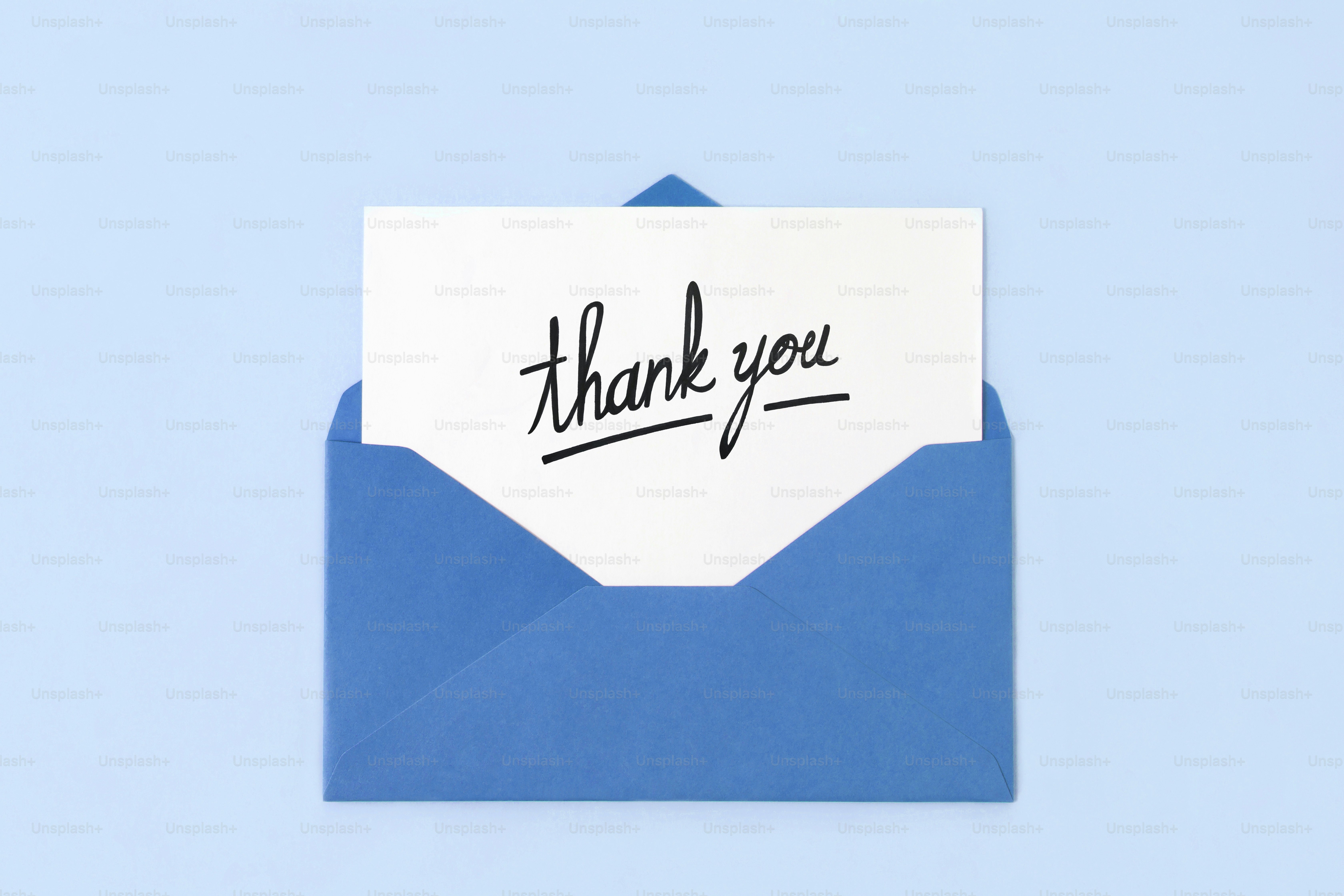 Blue envelope with thank you note on blue background photo – Blue Image ...